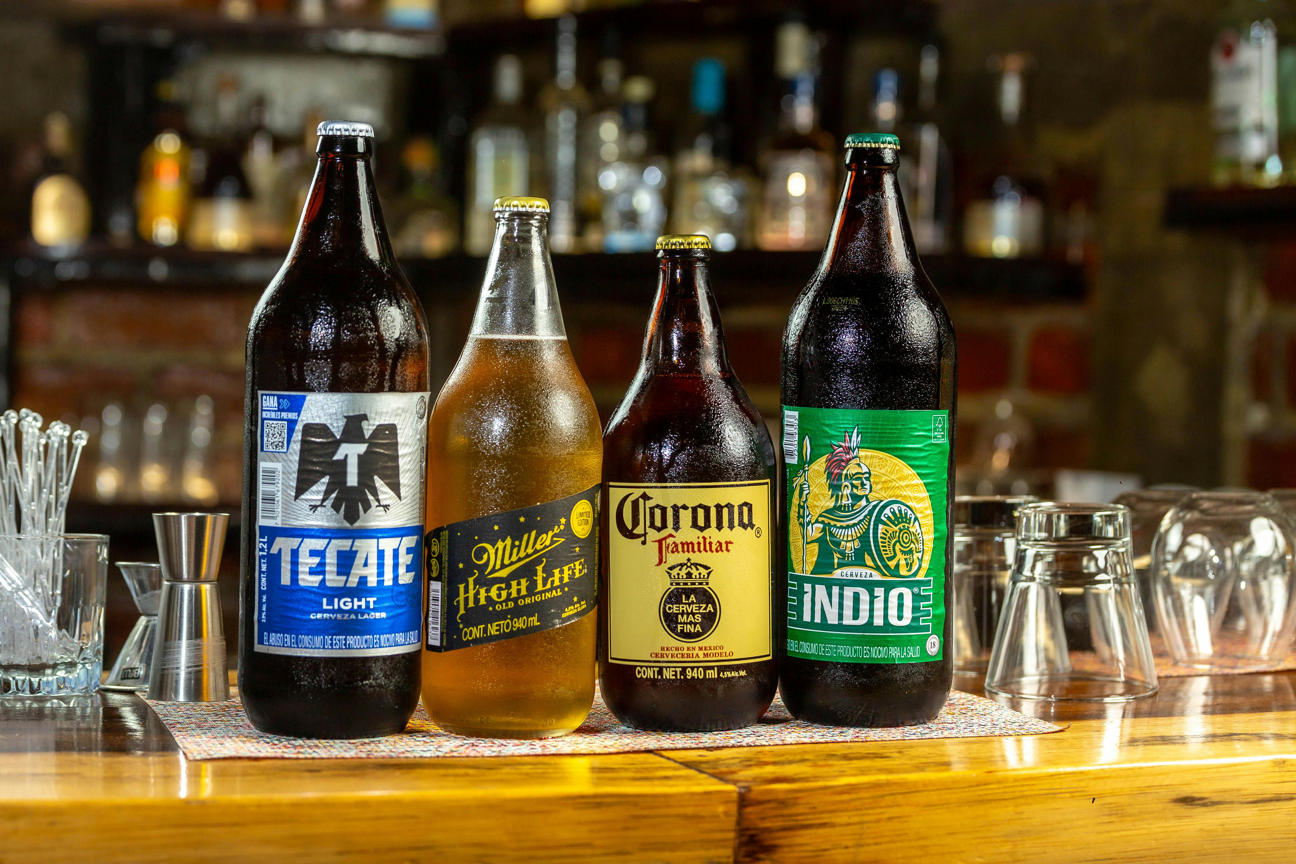 Bottles of Beer on Bar Counter · Free Stock Photo