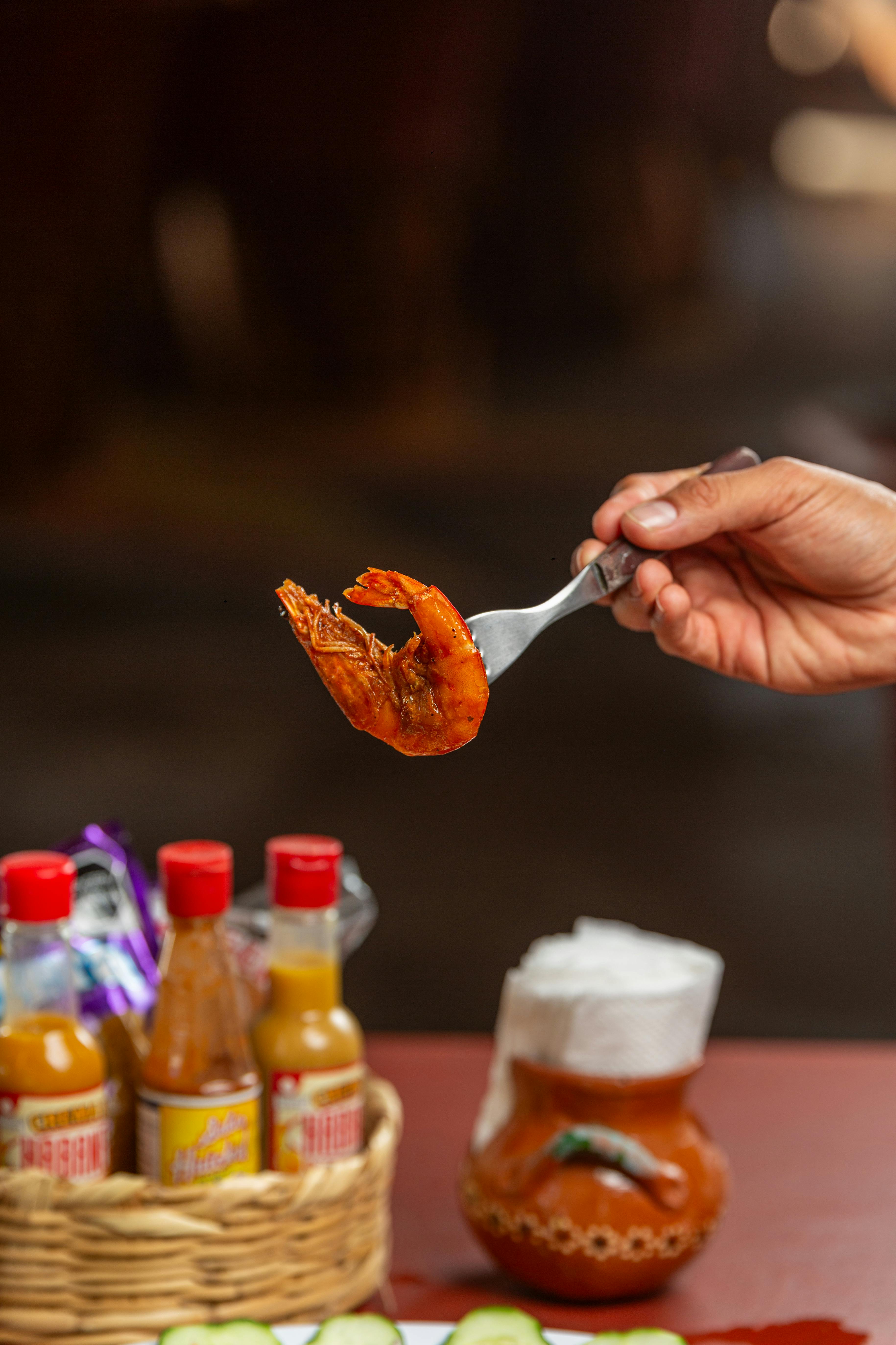Person Eating Shrimp · Free Stock Photo