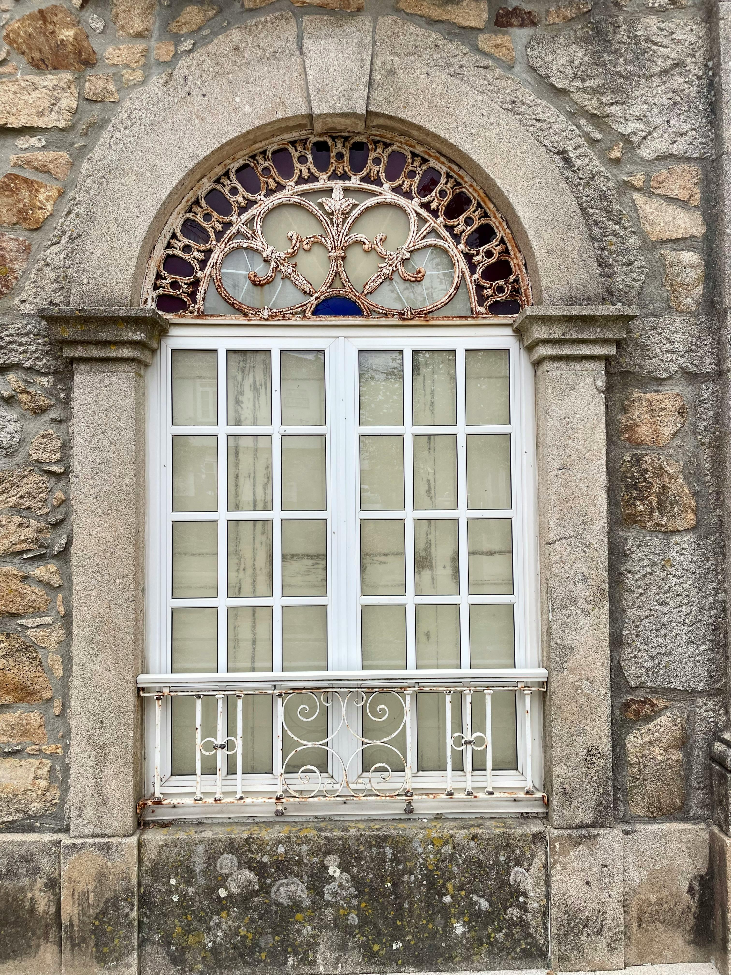 Windows on Stone Wall · Free Stock Photo