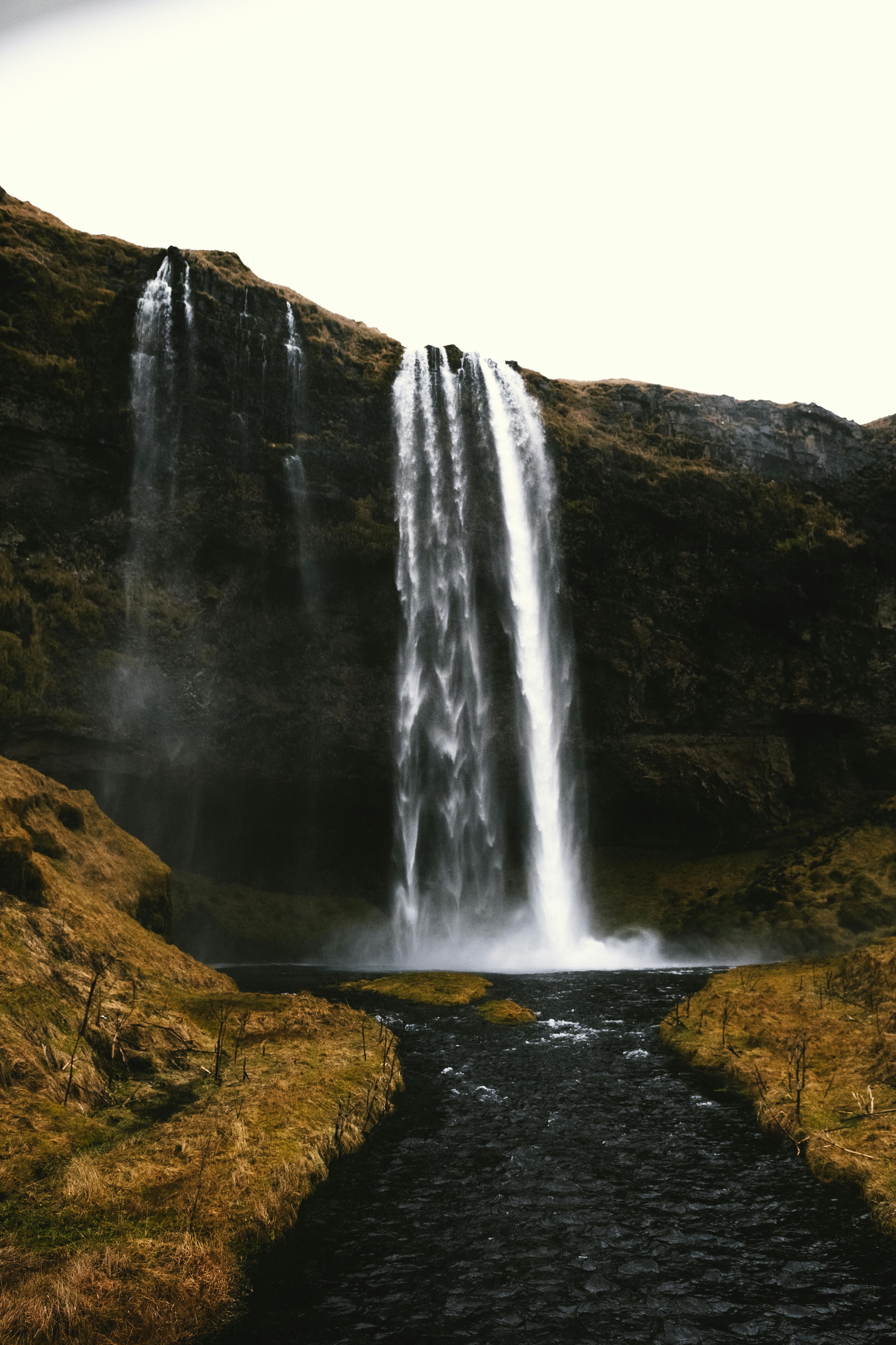A waterfall in iceland with the words, waterfall · Free Stock Photo