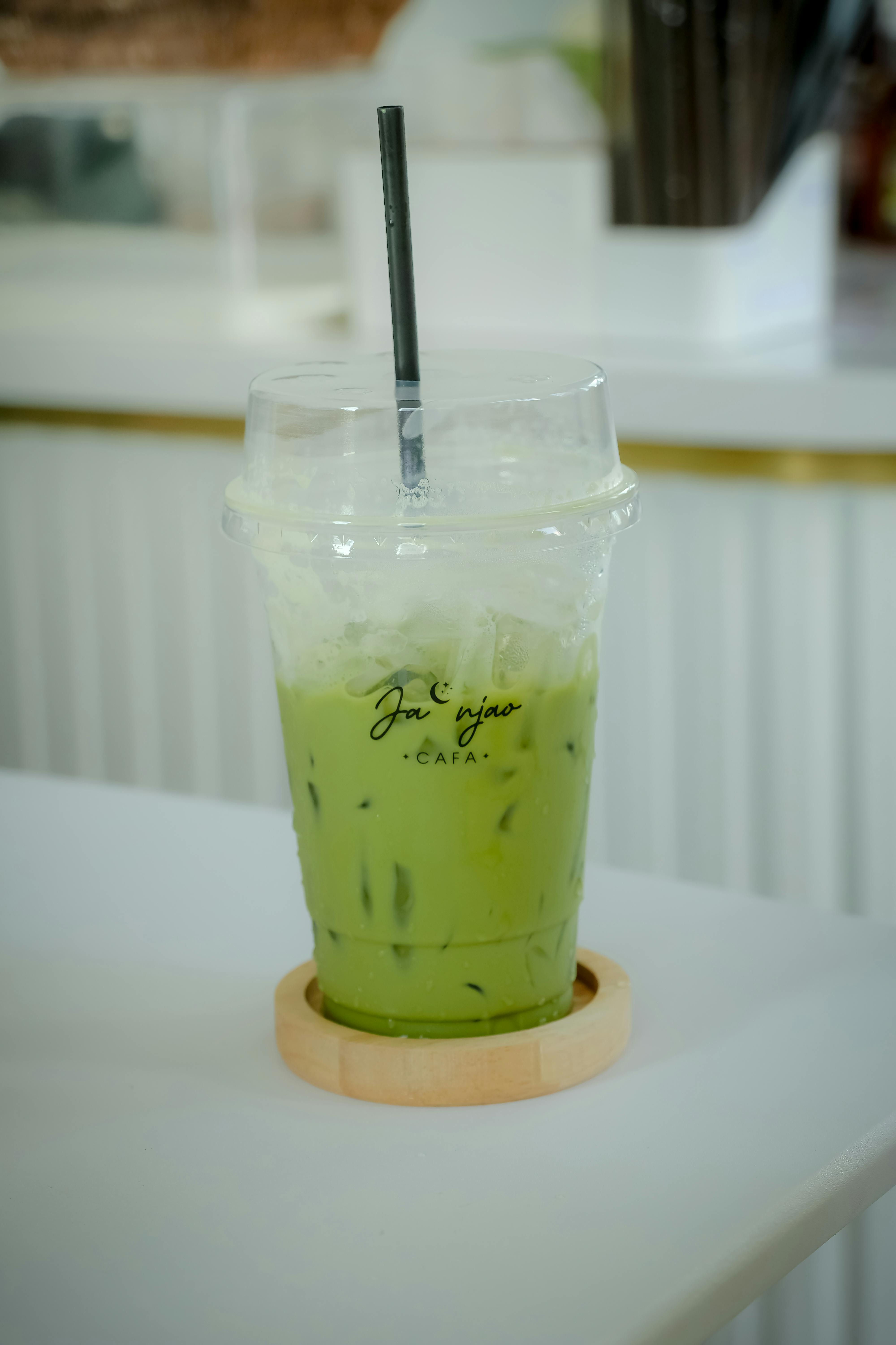 Close-up of a Cold Green Drink in a Plastic Cup · Free Stock Photo