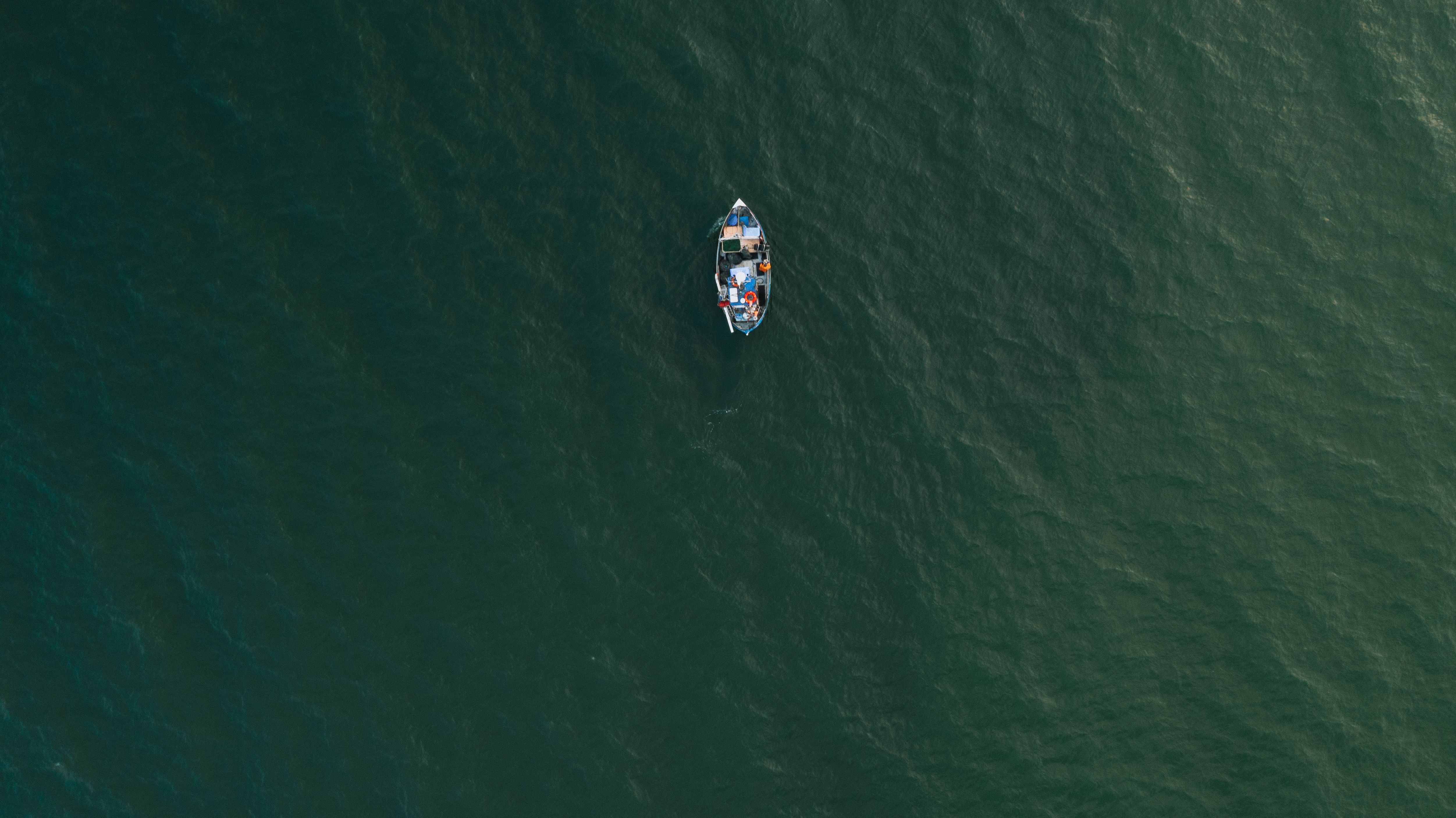 Aerial Photo of Woman Lying on Inflatable Floater in the Middle of ...