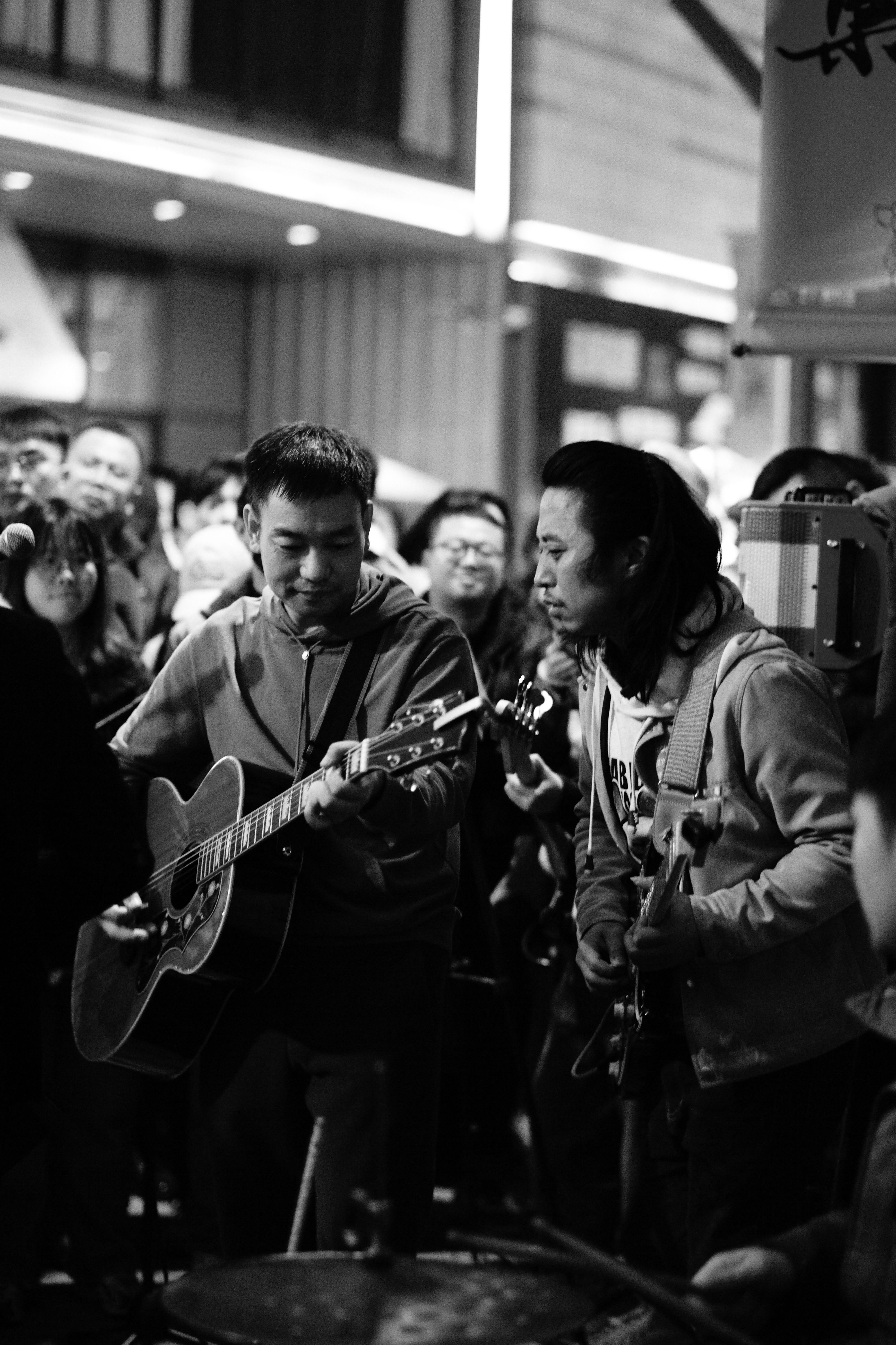 Crowd of Passersby Around a Band Playing in the Street · Free Stock Photo
