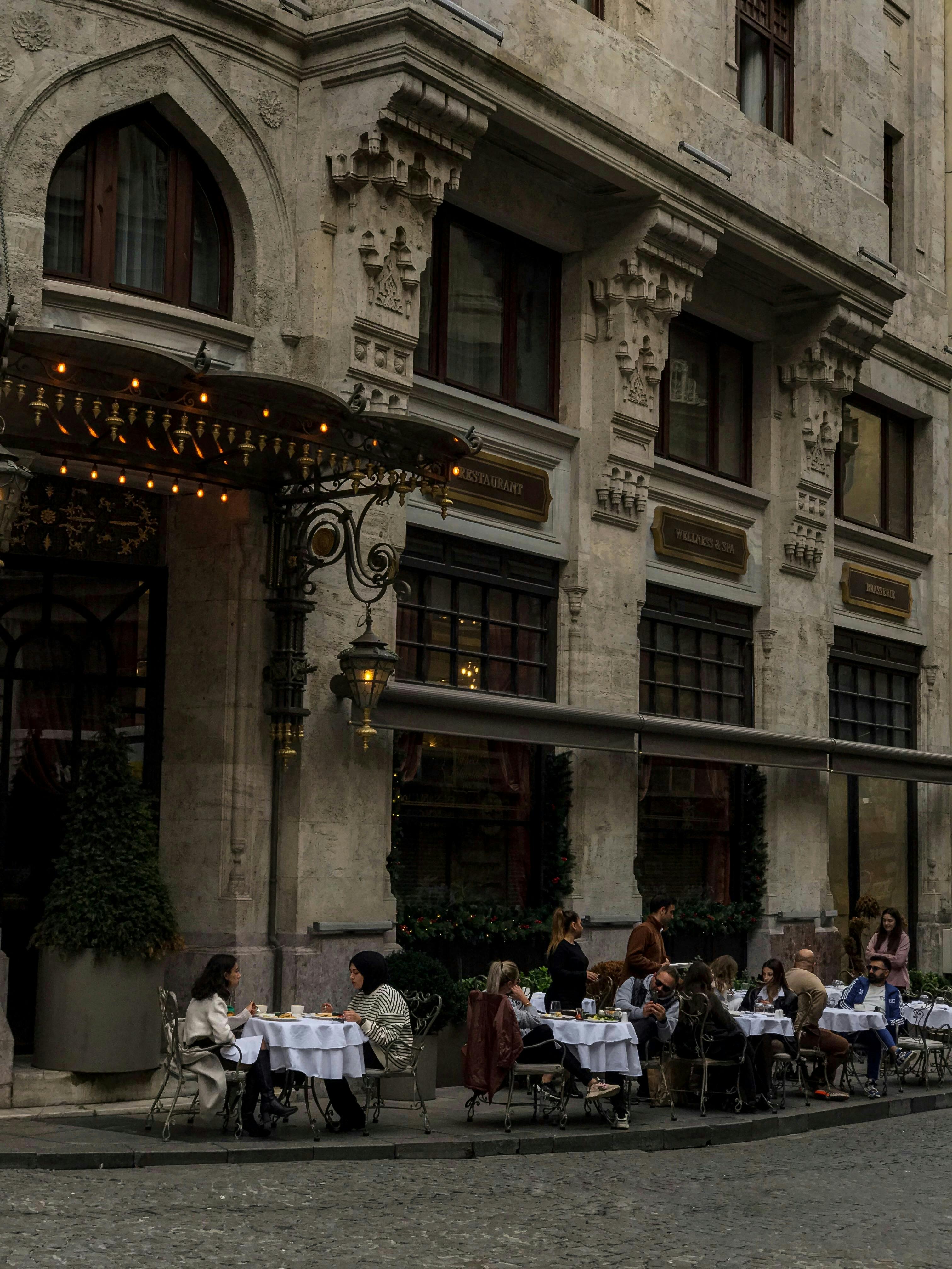 Restaurant Guests at Tables on the Sidewalk · Free Stock Photo