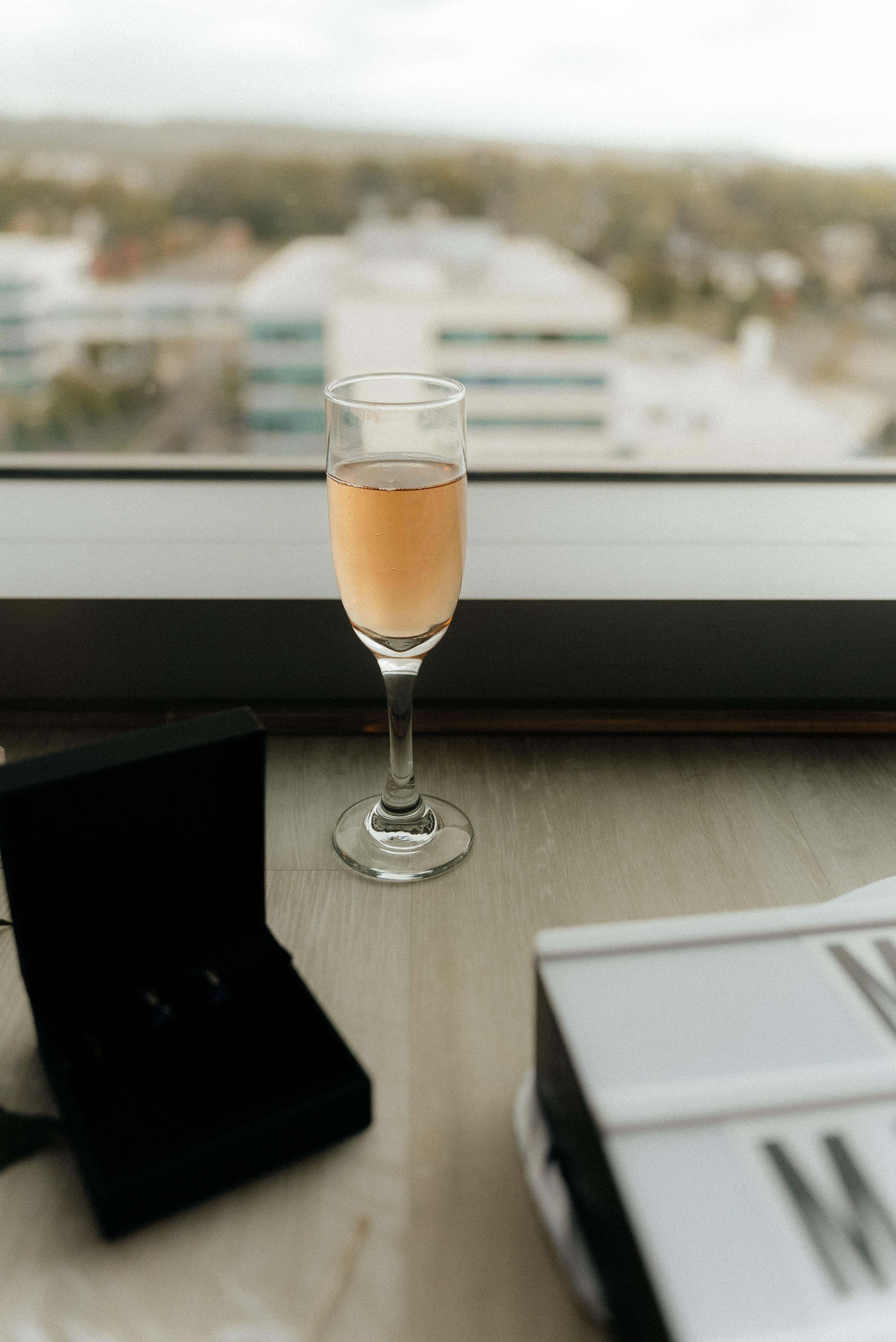 A Glass of Champagne Standing by the Window · Free Stock Photo