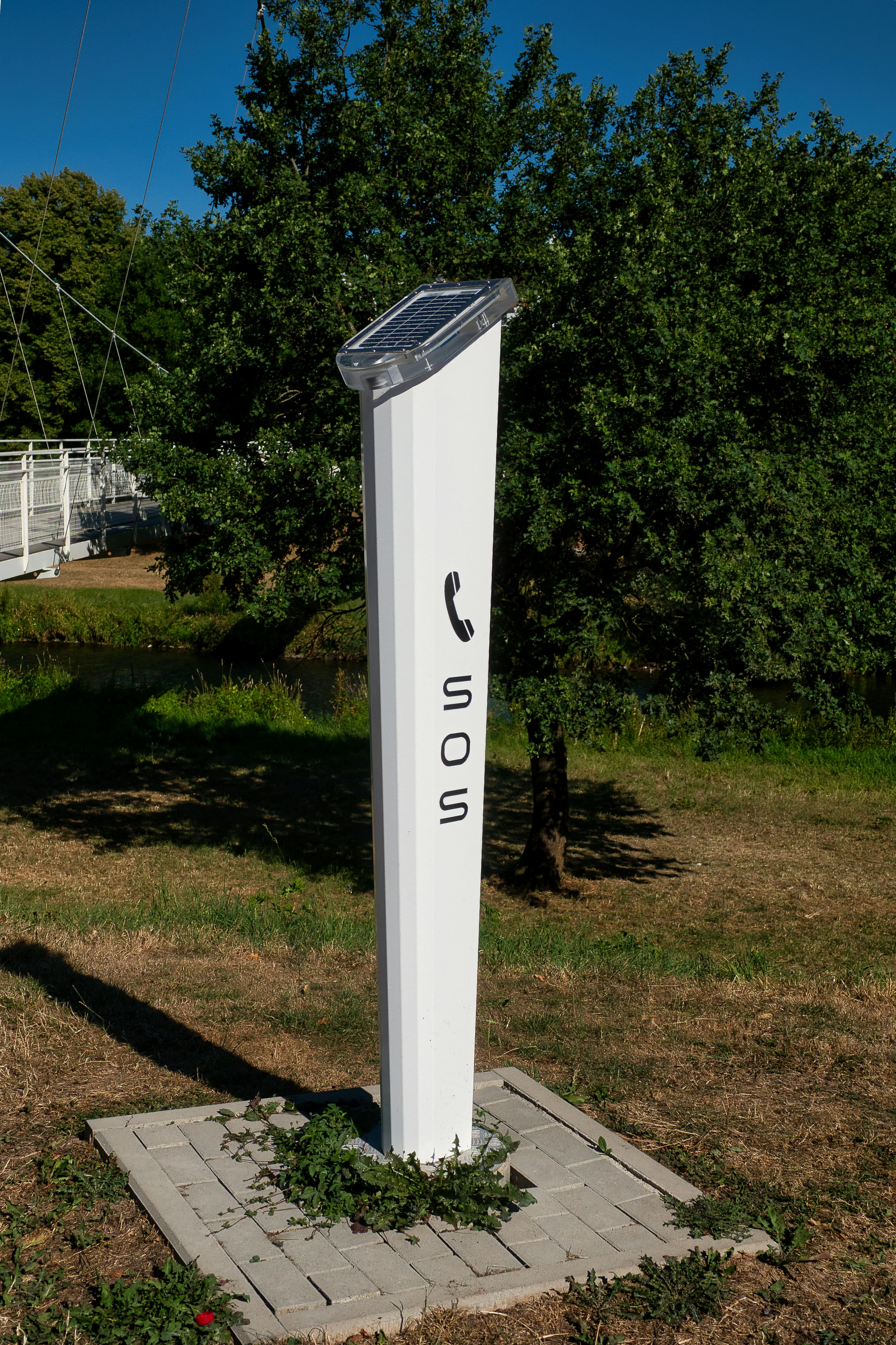 SOS Post on Grass · Free Stock Photo