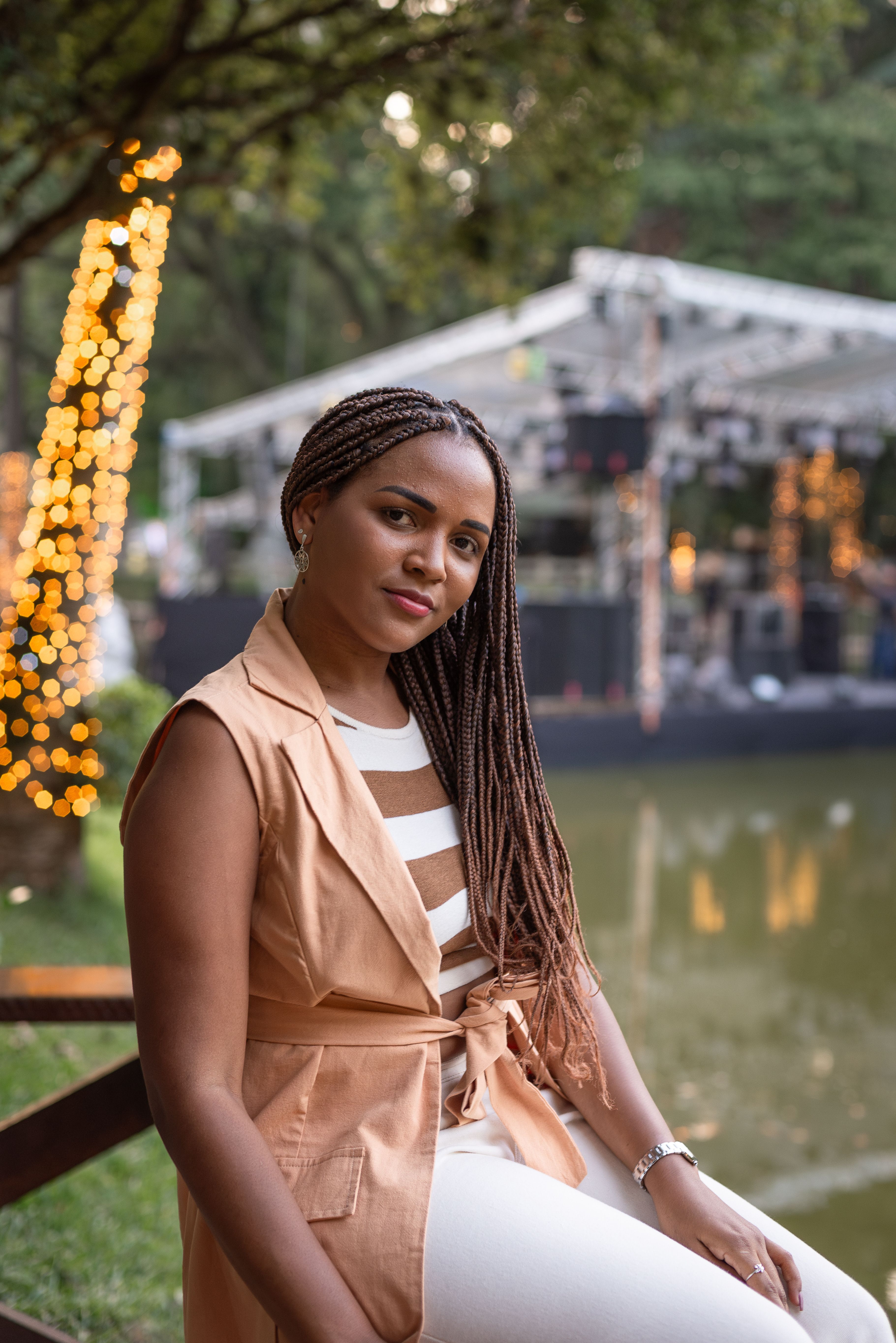 Woman Sitting by the Stream in a Park · Free Stock Photo