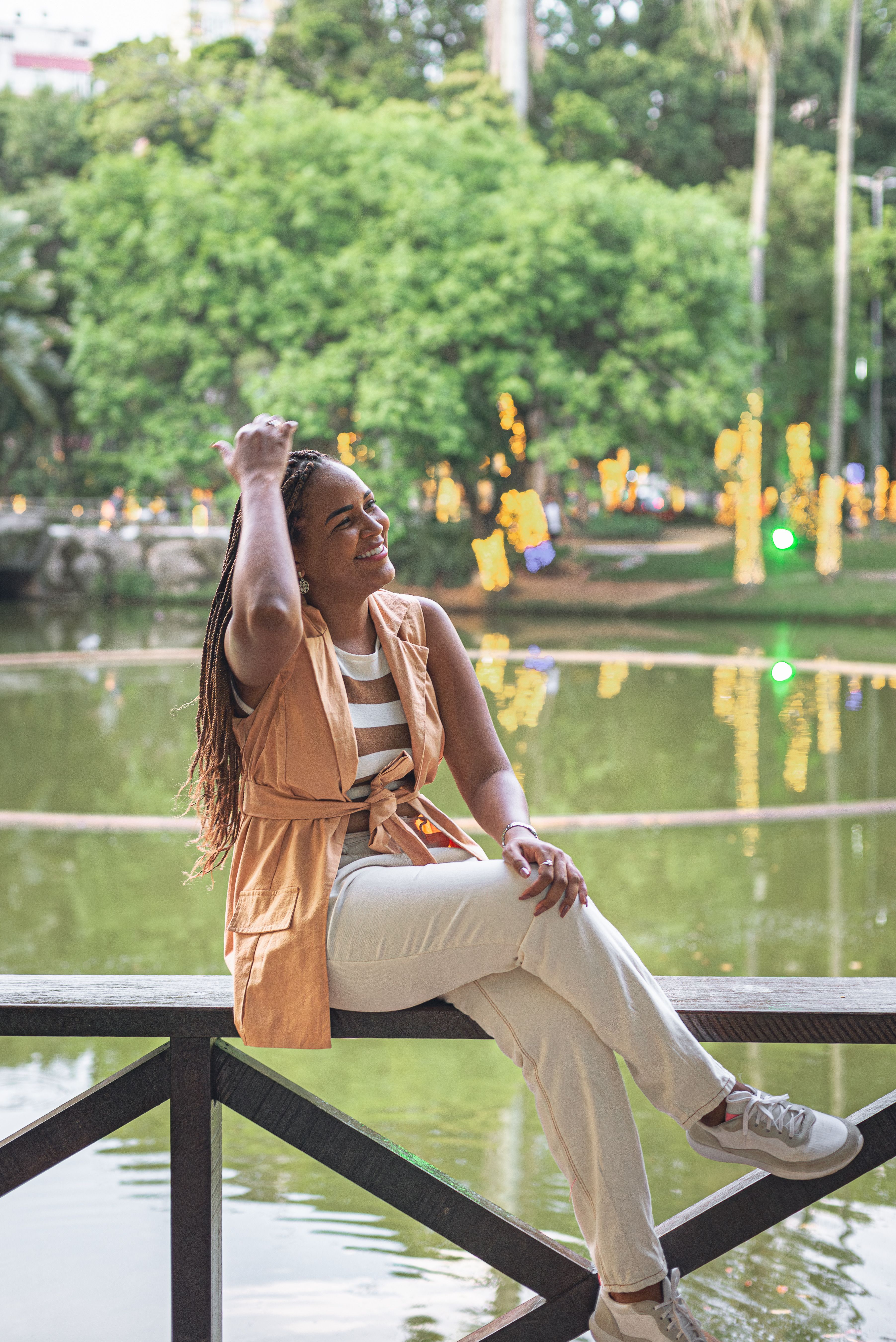 Woman Sitting by the Stream in a Park · Free Stock Photo