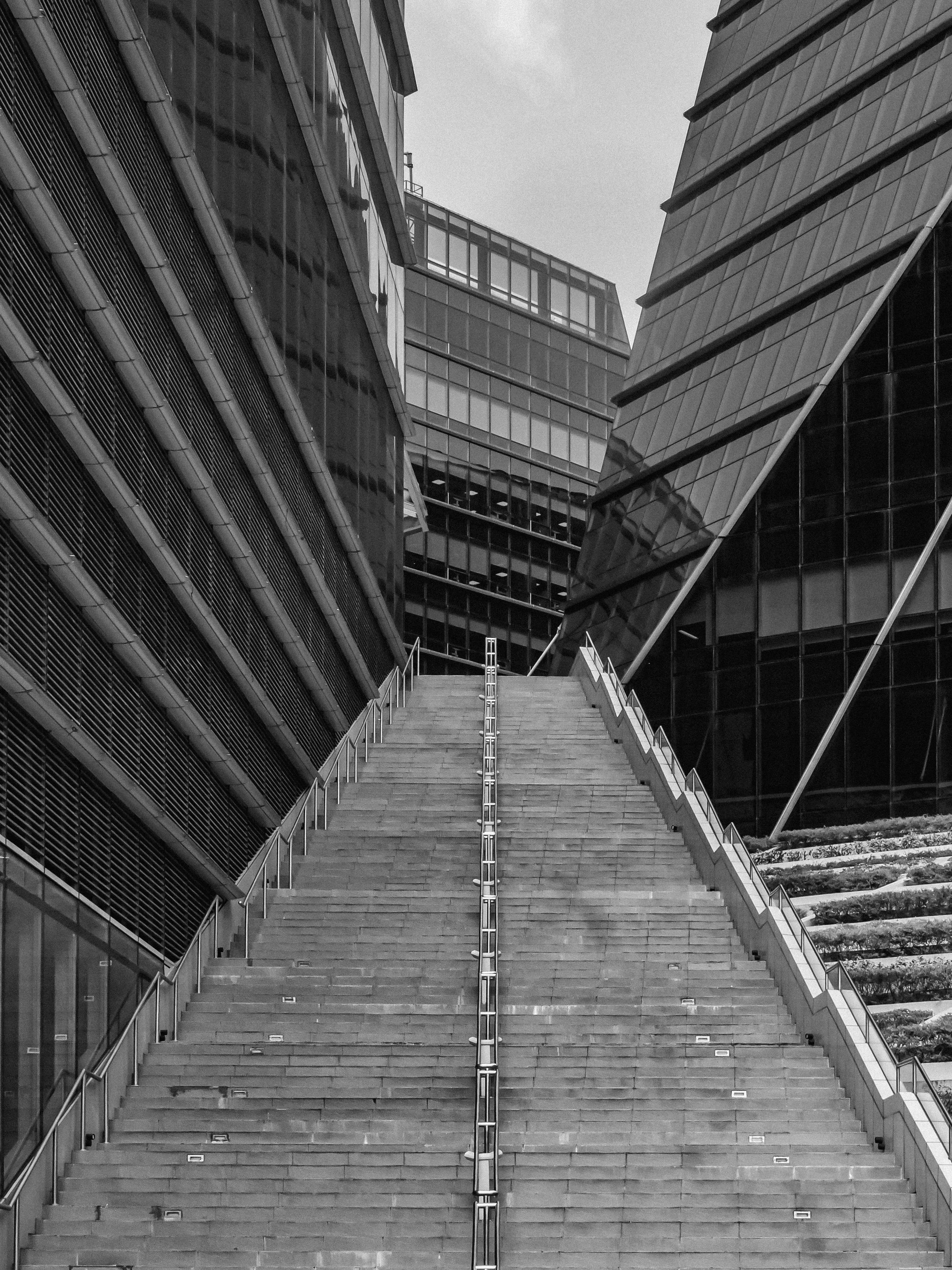 Stairs in Front of a Modern Building in Black and White · Free Stock Photo