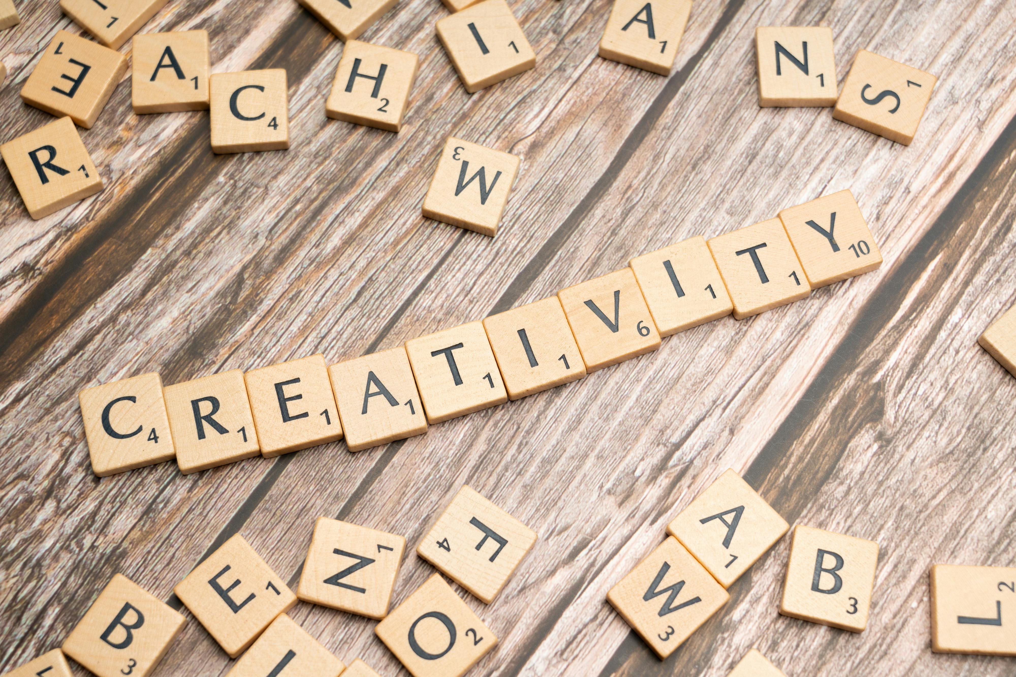 The word creativity spelled out with scrabble tiles · Free Stock Photo