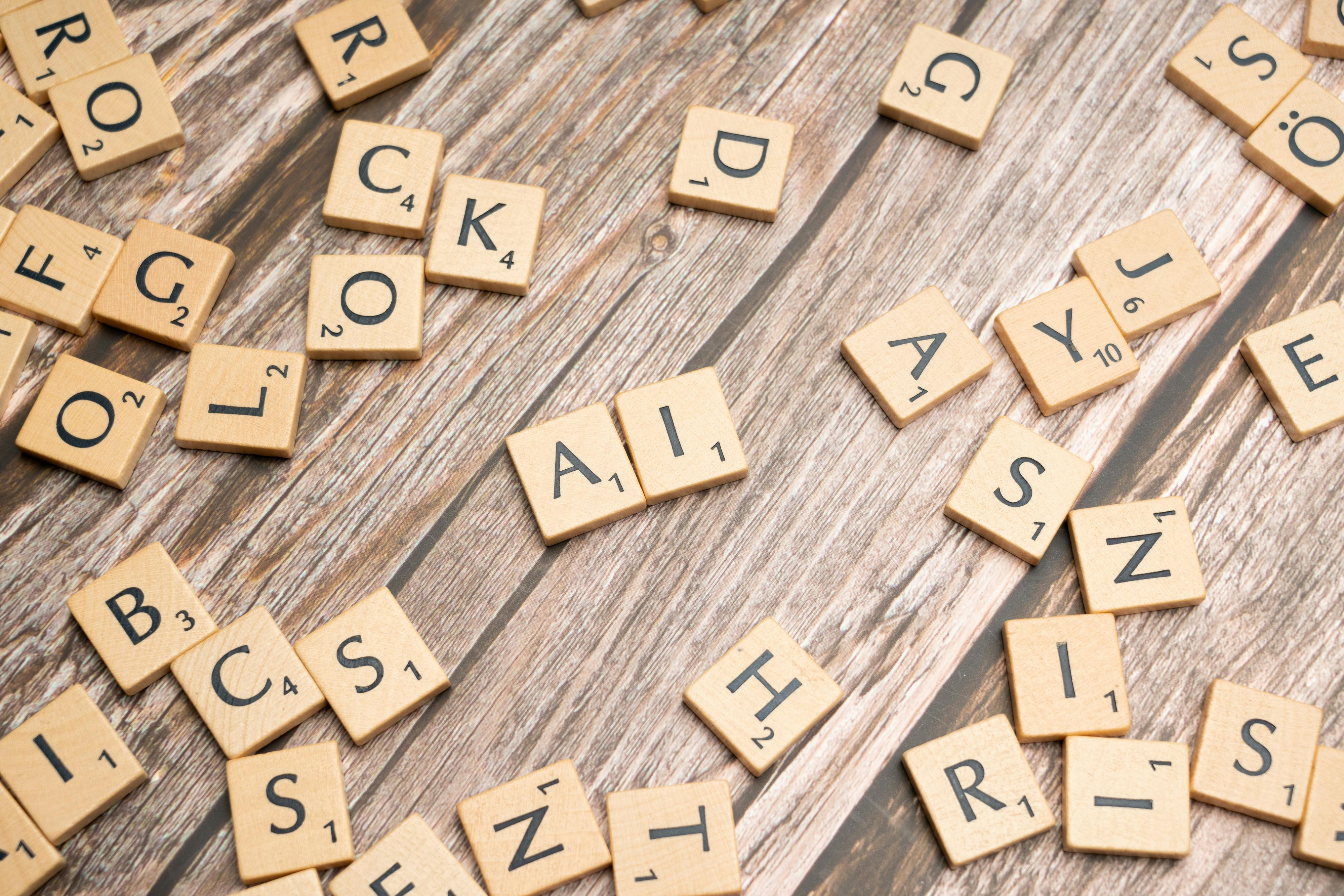 Scrabble tiles on a wooden table with the word rock · Free Stock Photo