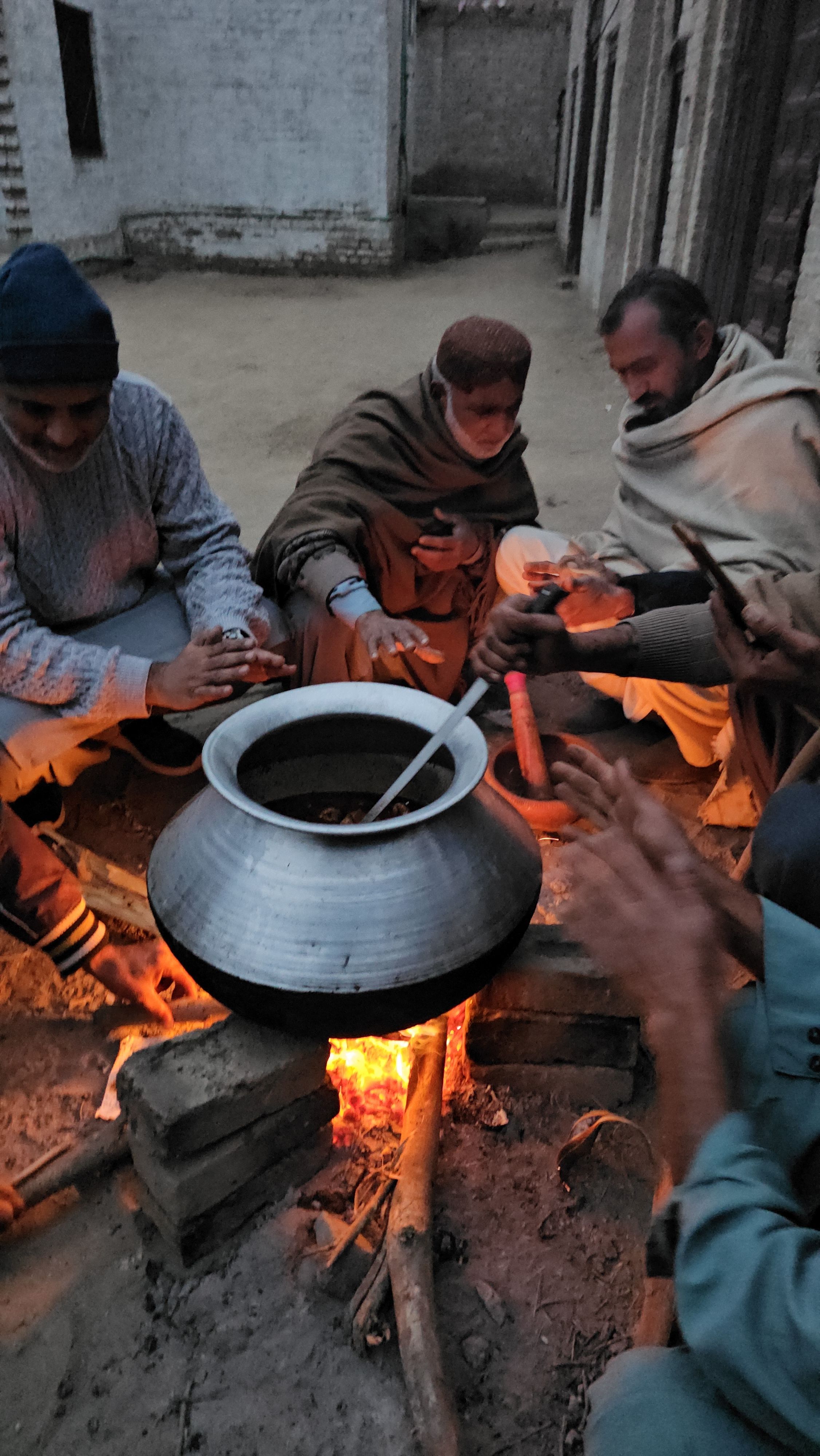 Men Sitting ny Bonfire and Cooking · Free Stock Photo