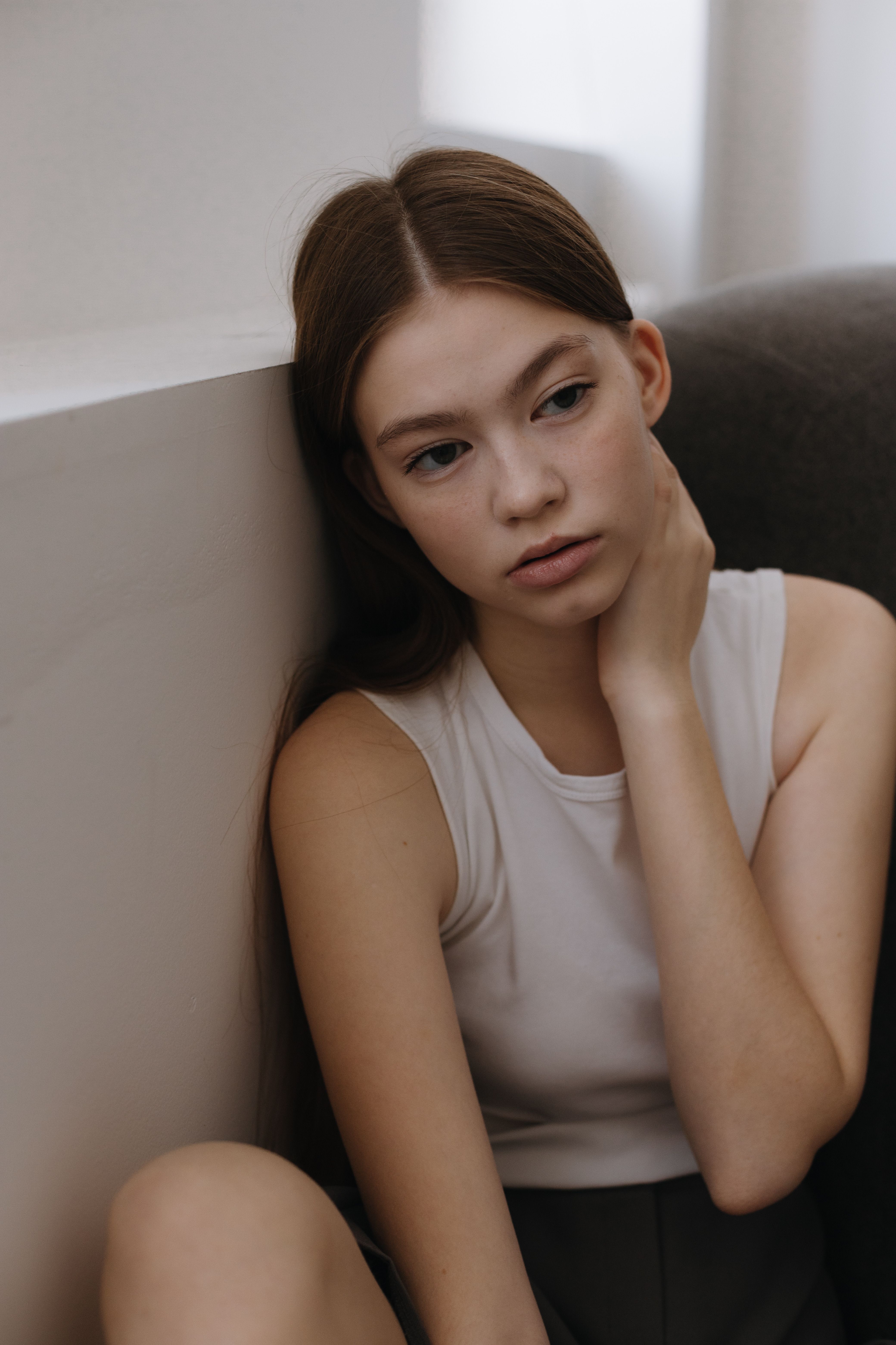 Portrait of Woman with Hand on Neck · Free Stock Photo