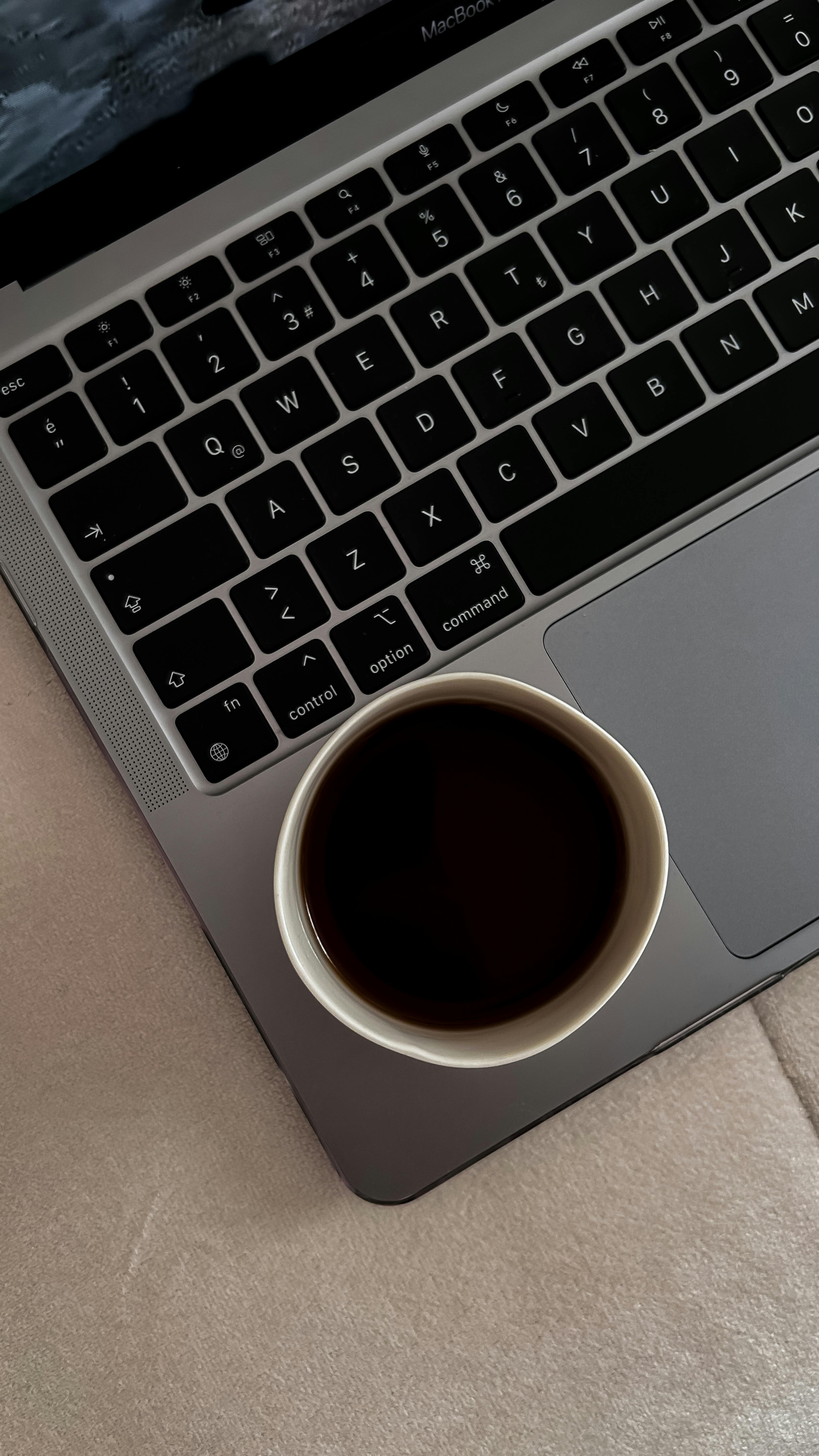 Cup of Coffee on Laptop · Free Stock Photo
