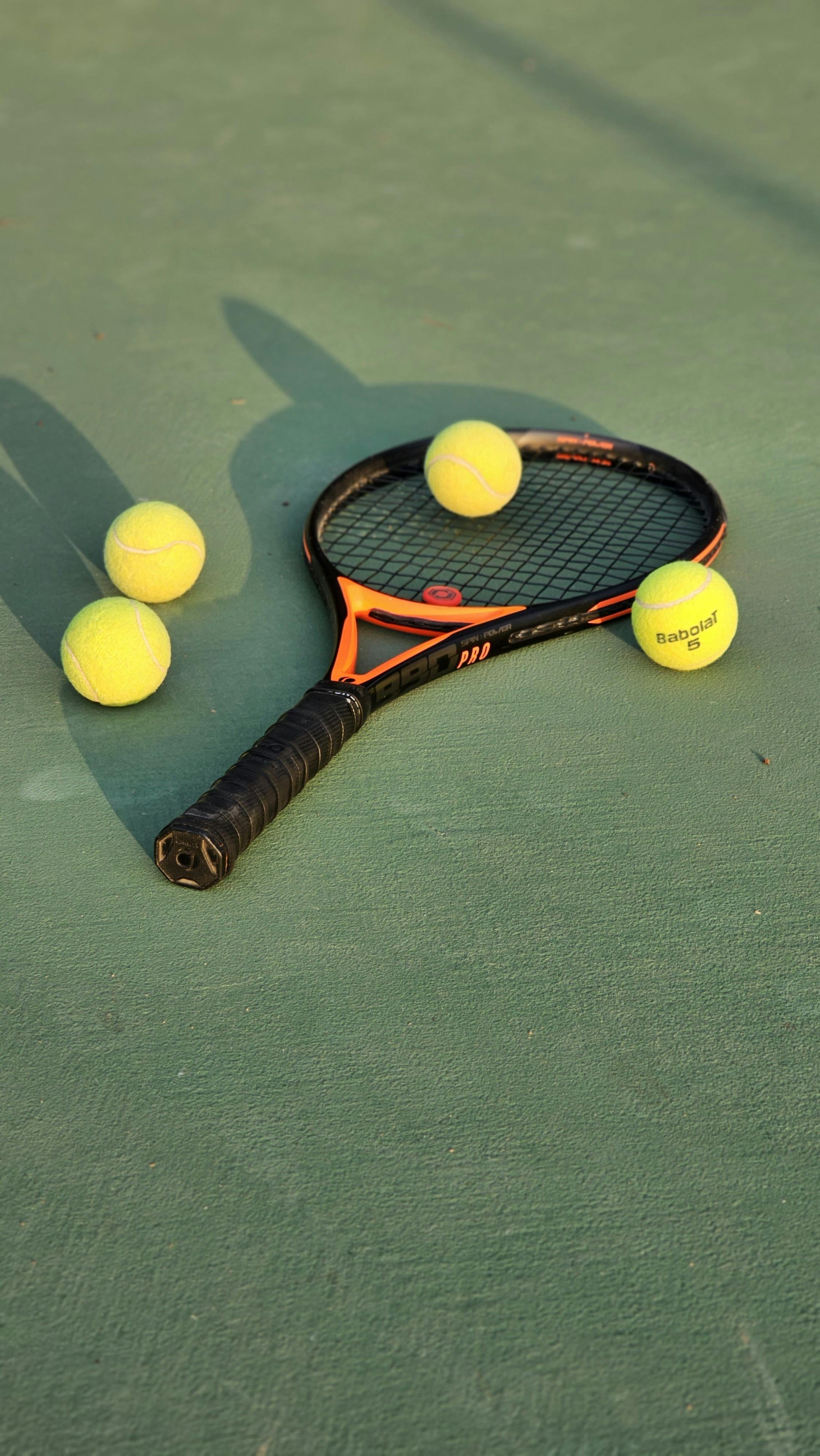 Orange Tennis Racket Beside Green Tennis Ball · Free Stock Photo