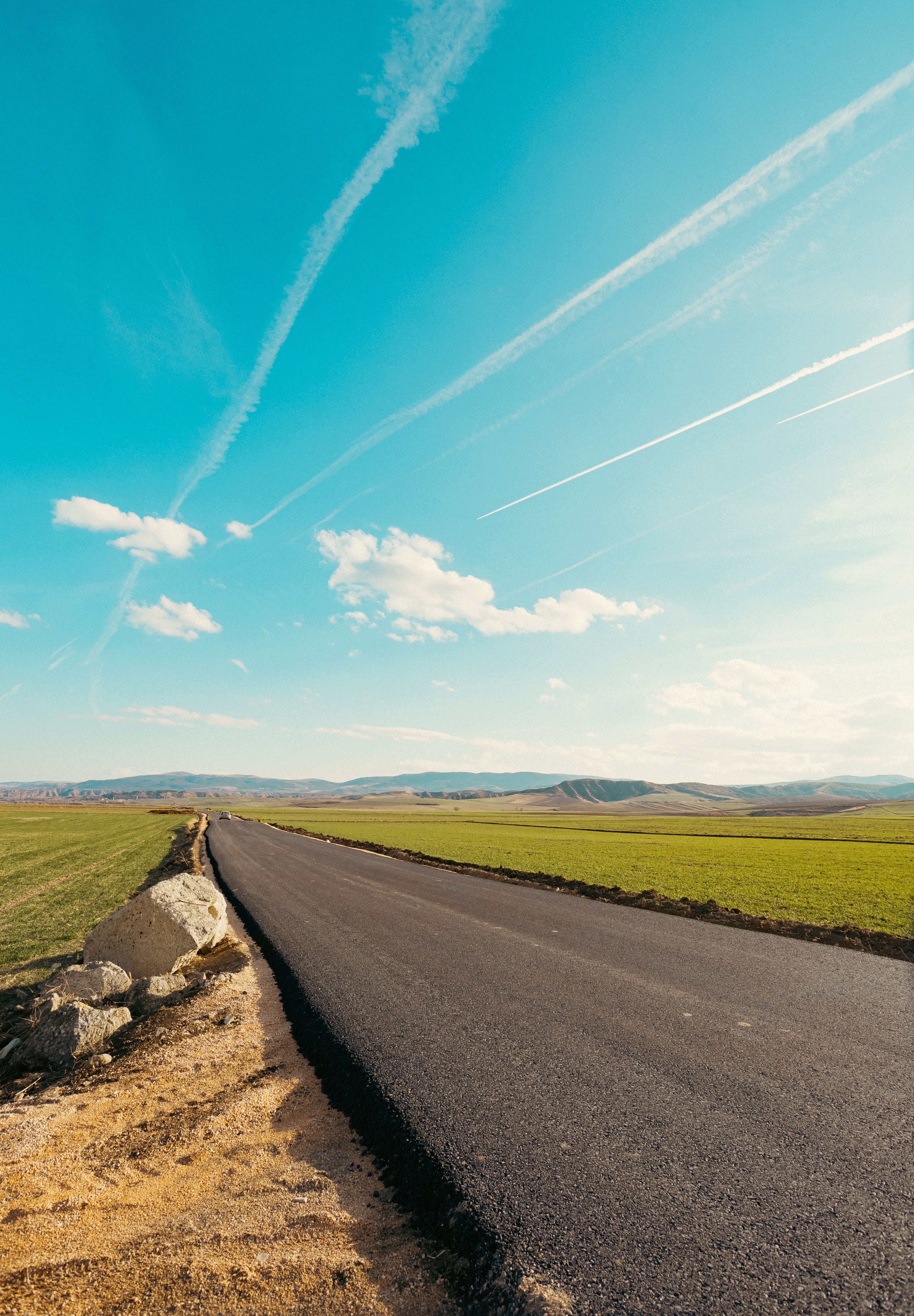 Empty Road between Fields on Plains · Free Stock Photo