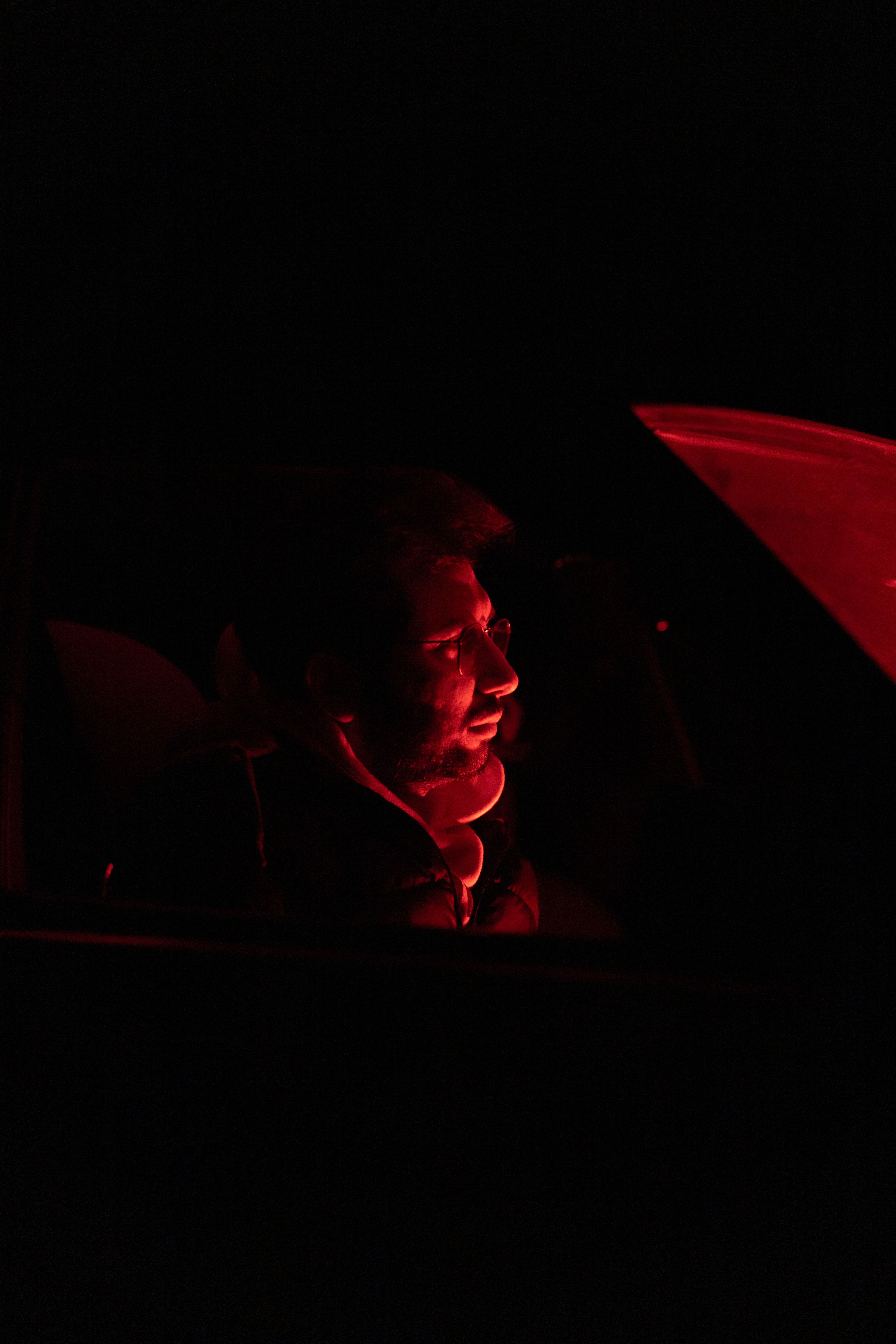 Red Light over Man in Car · Free Stock Photo
