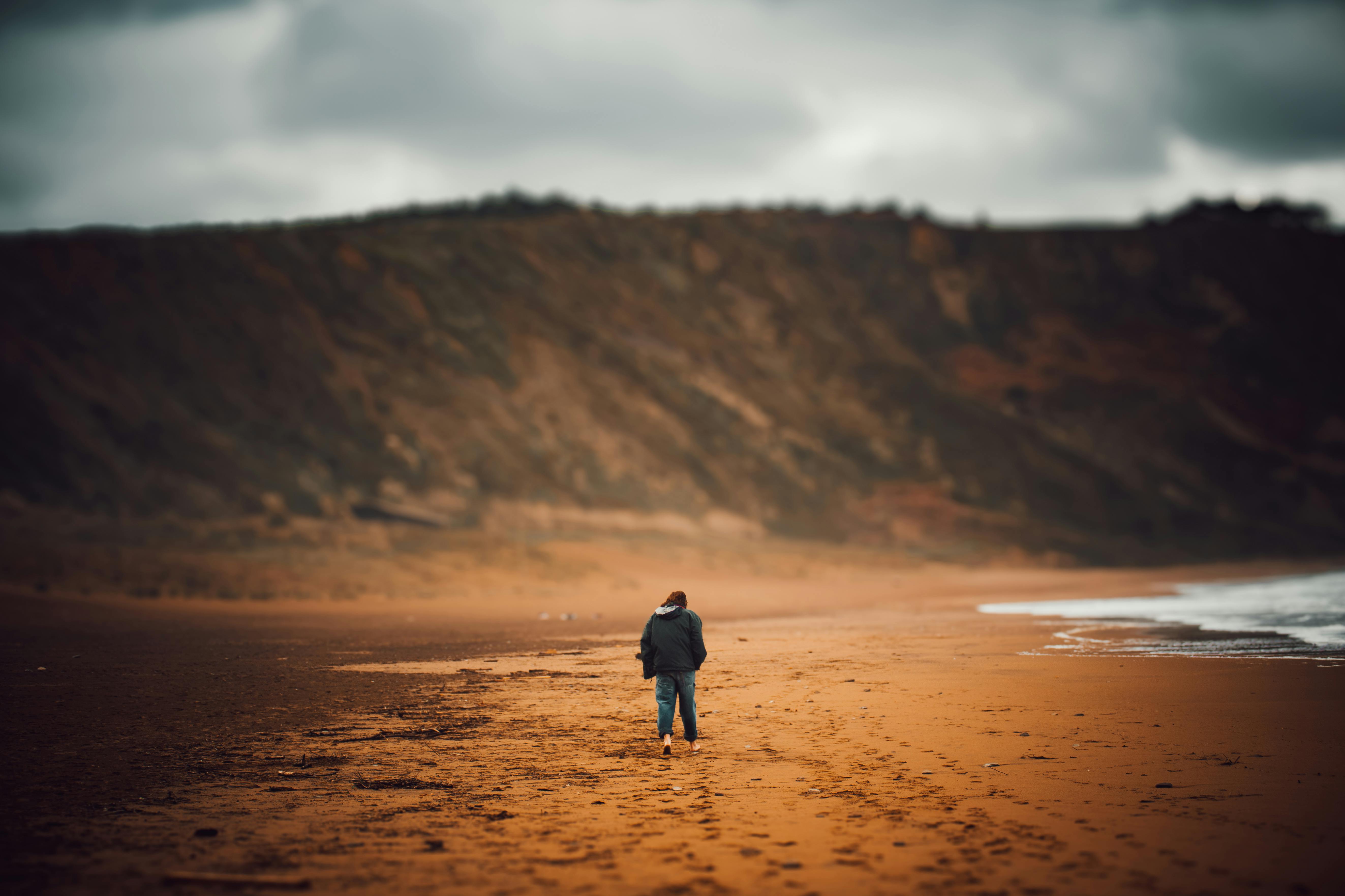 Photo of Person Walking on Deserted Island · Free Stock Photo