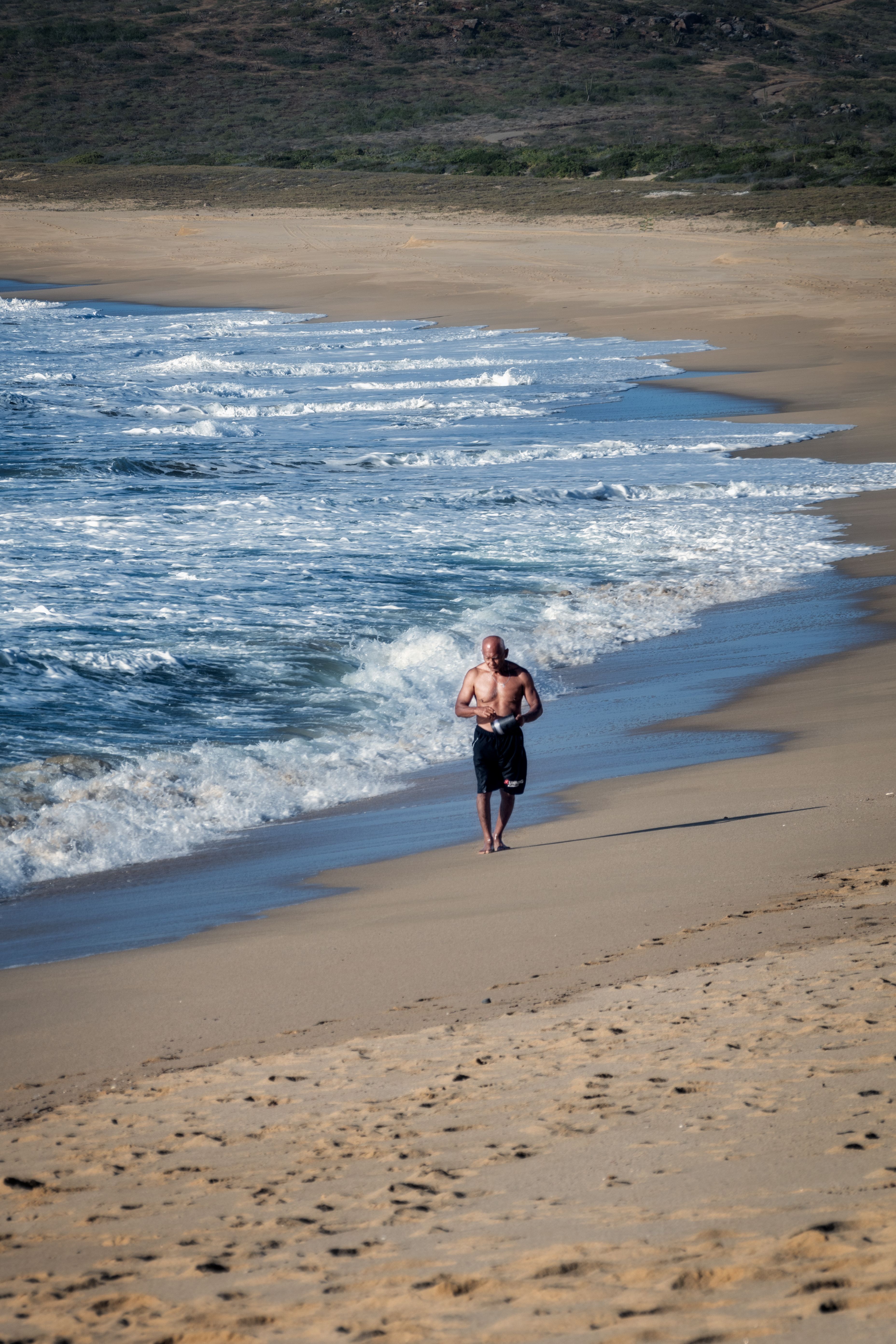 Man Walking on Beach in Summer · Free Stock Photo