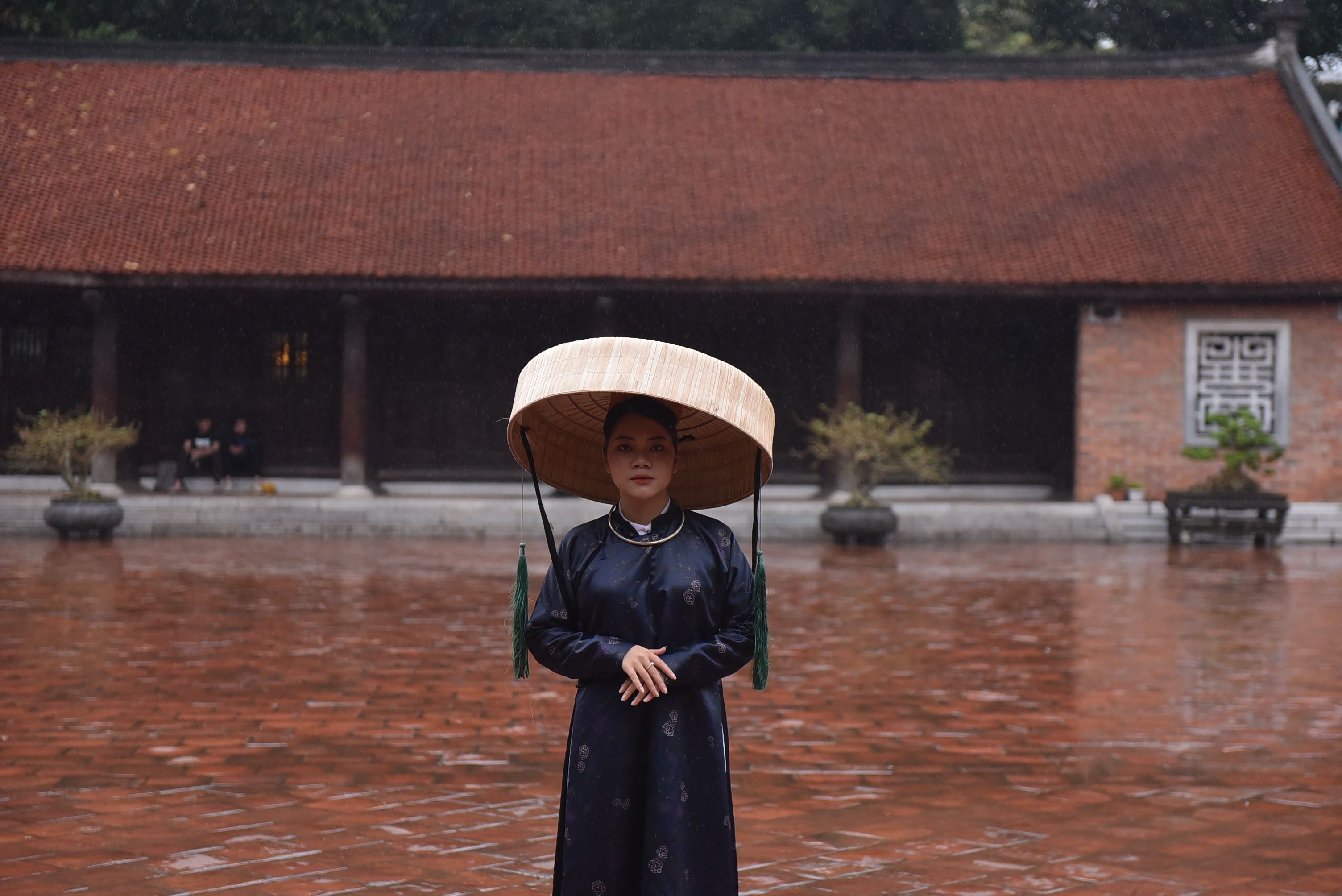 Woman in Traditional Clothing and Hat in Rain · Free Stock Photo