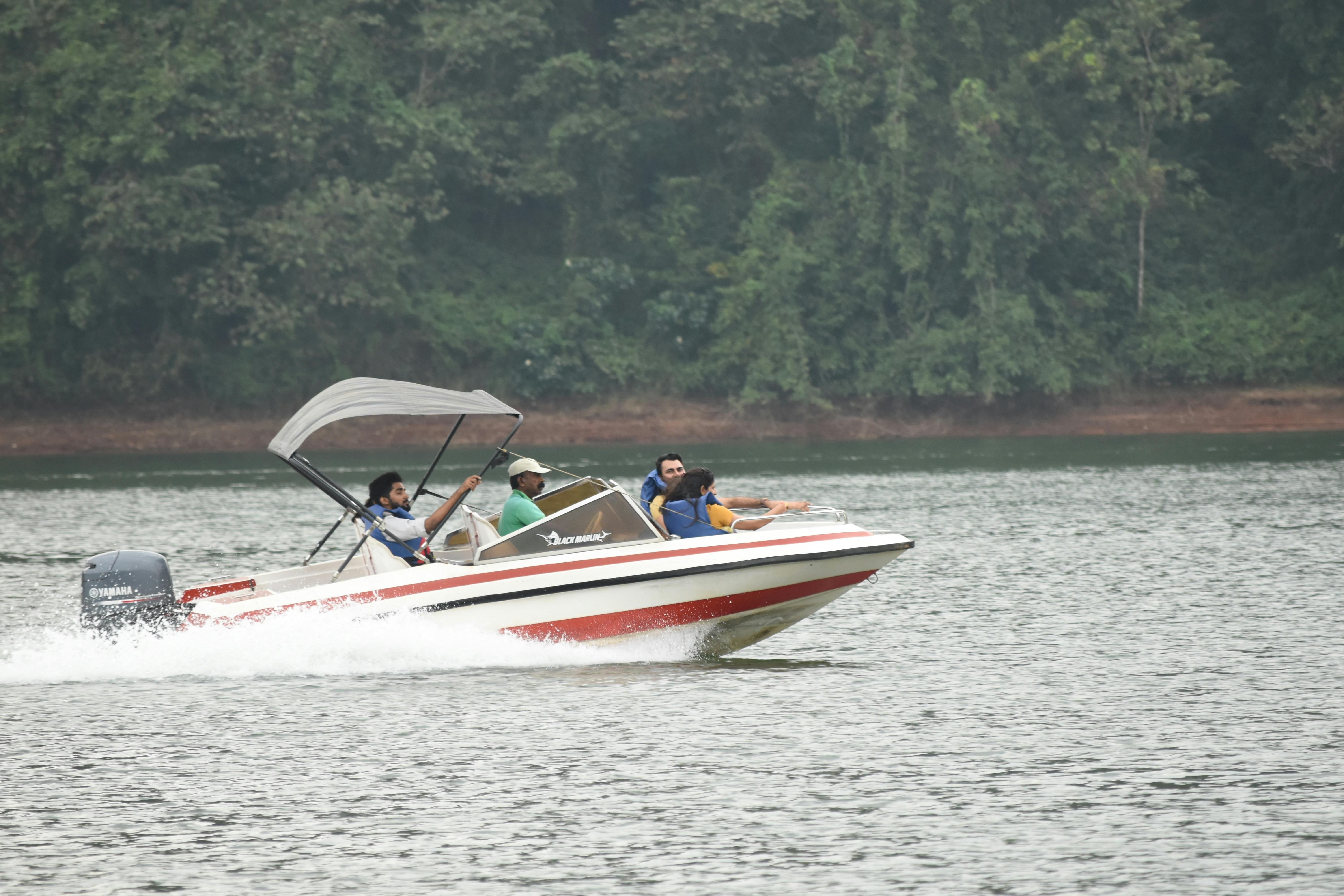 People Riding a Motorboat on a Body of Water · Free Stock Photo