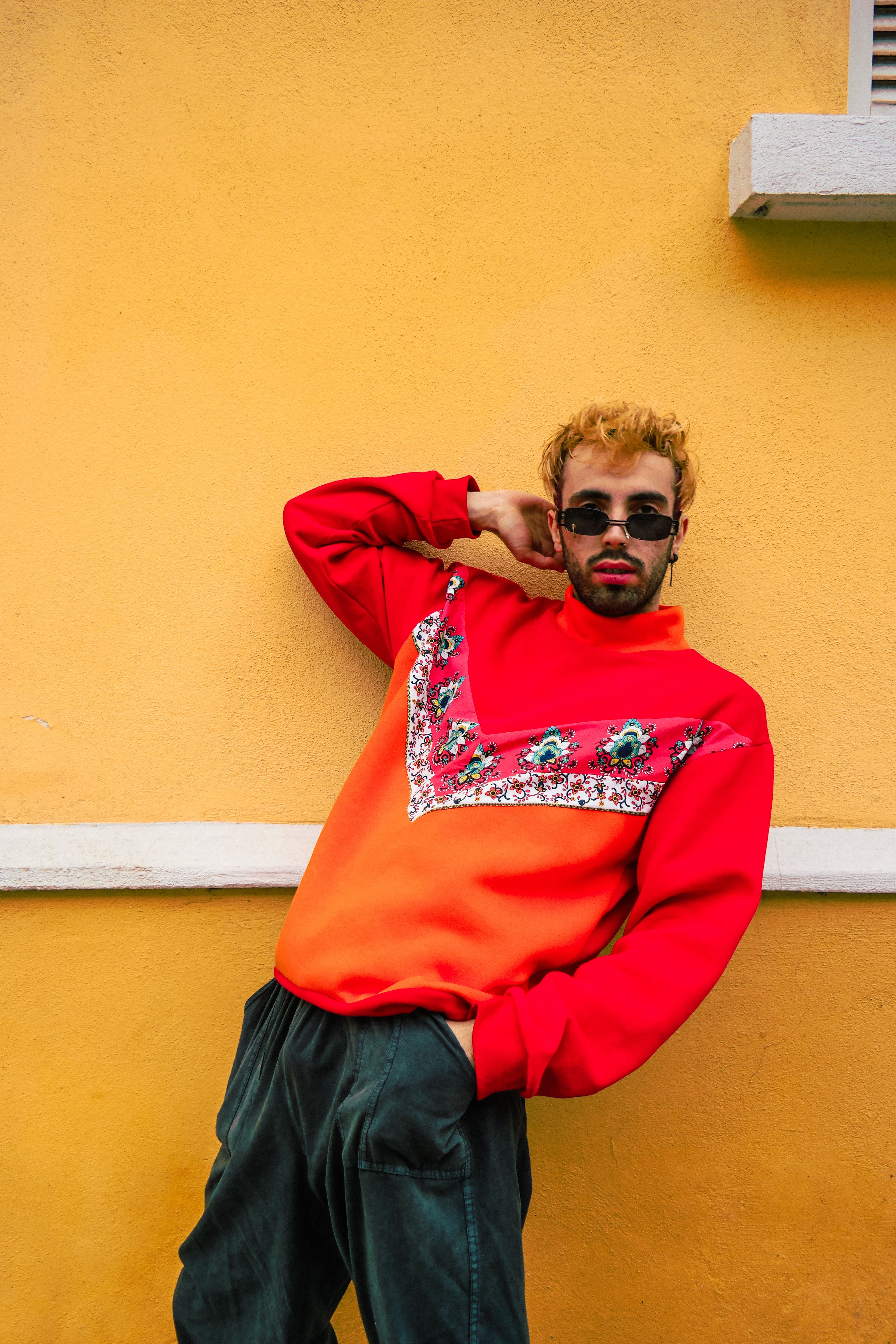 Man Posing by the Wall · Free Stock Photo