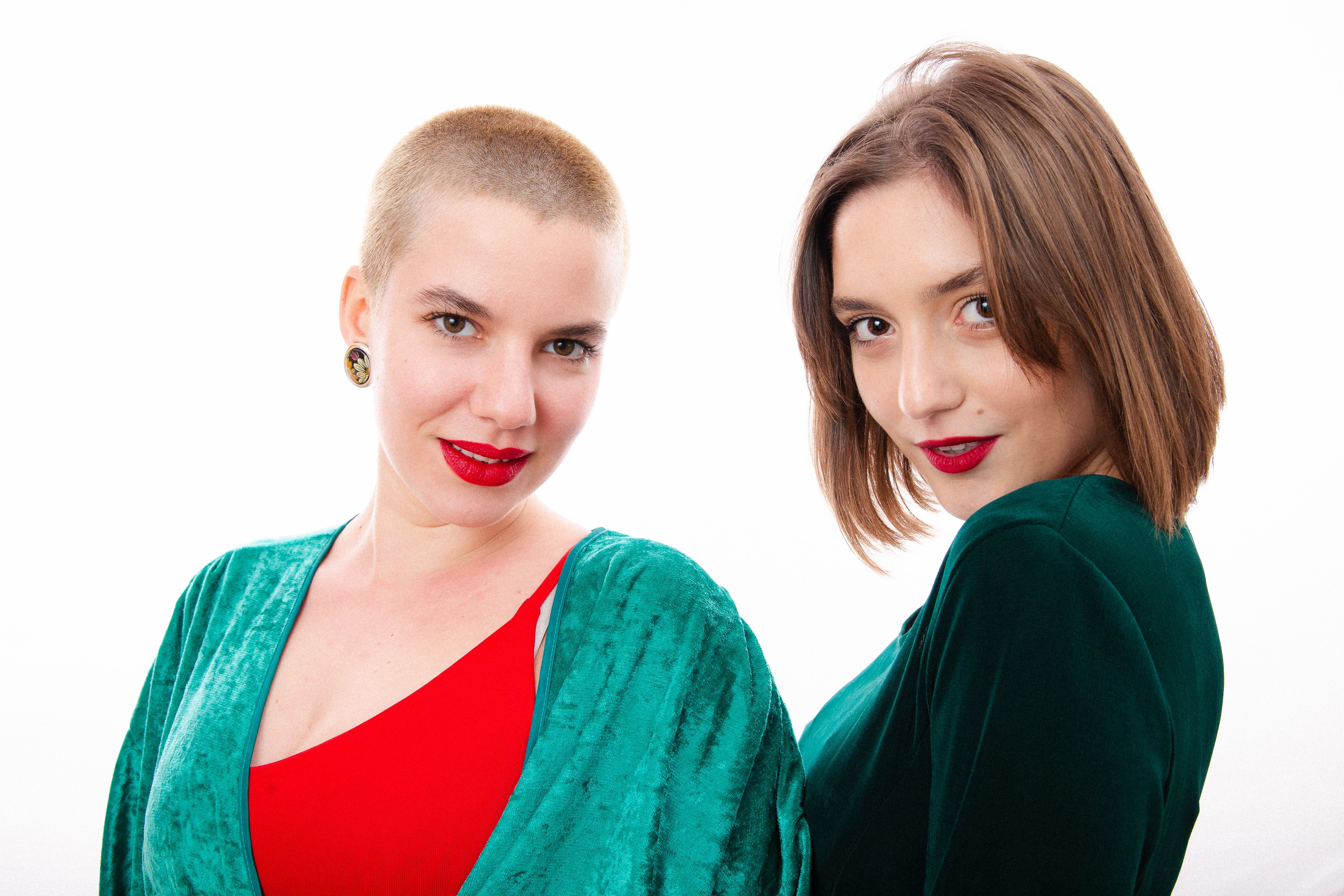 Women in Green Clothes Posing in Studio · Free Stock Photo