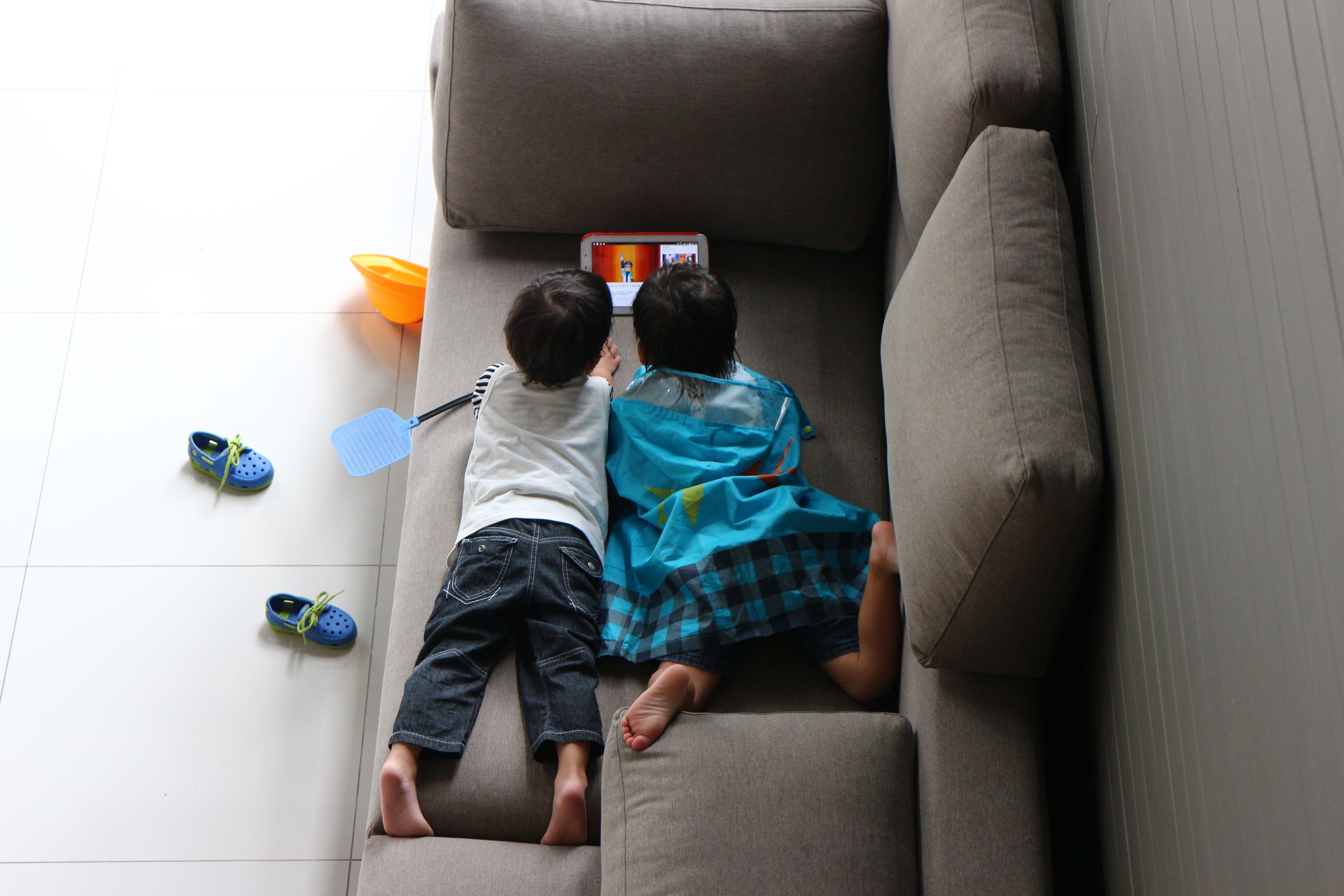 two kids watch the tablet · Free Stock Photo
