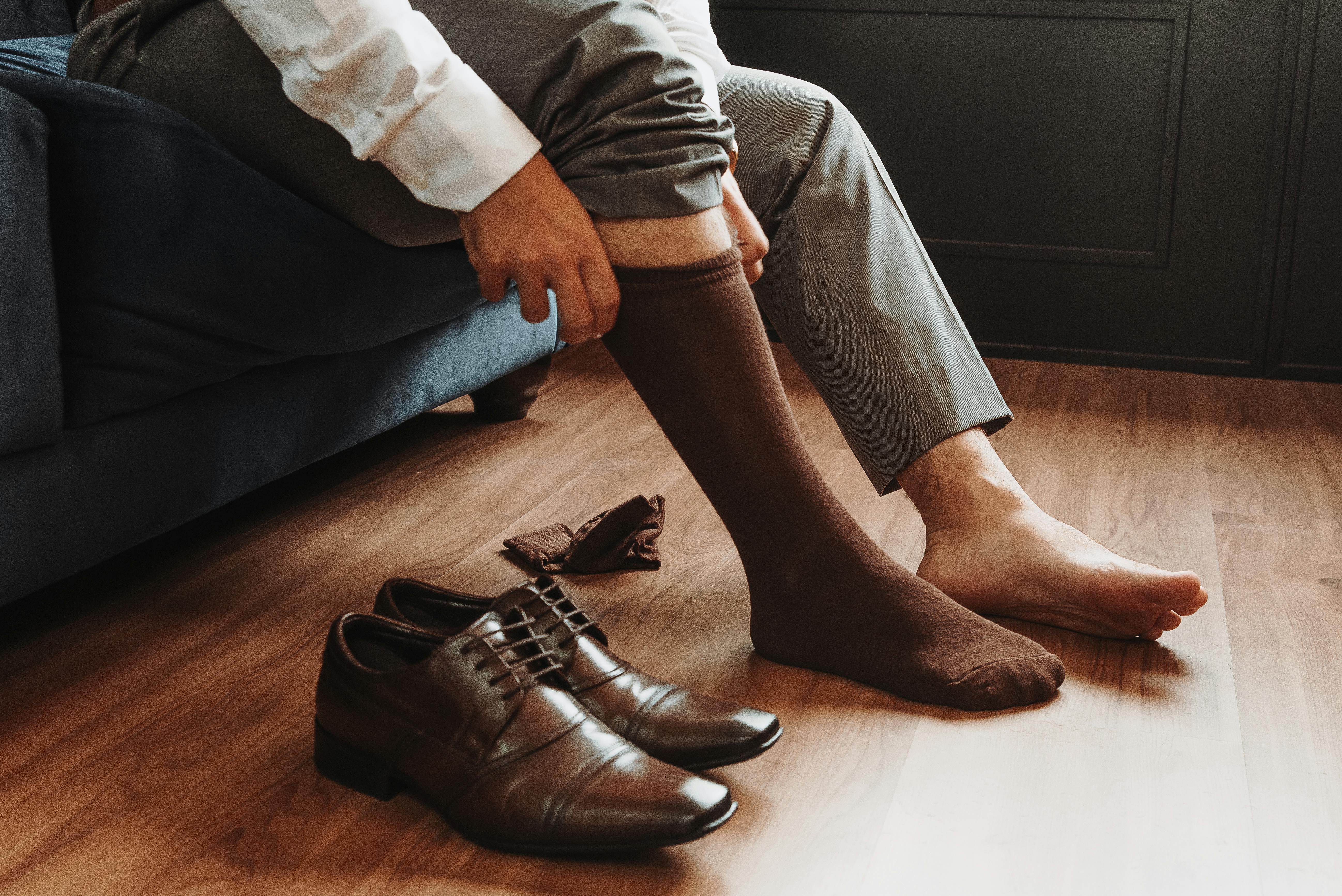 Man Dressing Brown Stocks · Free Stock Photo