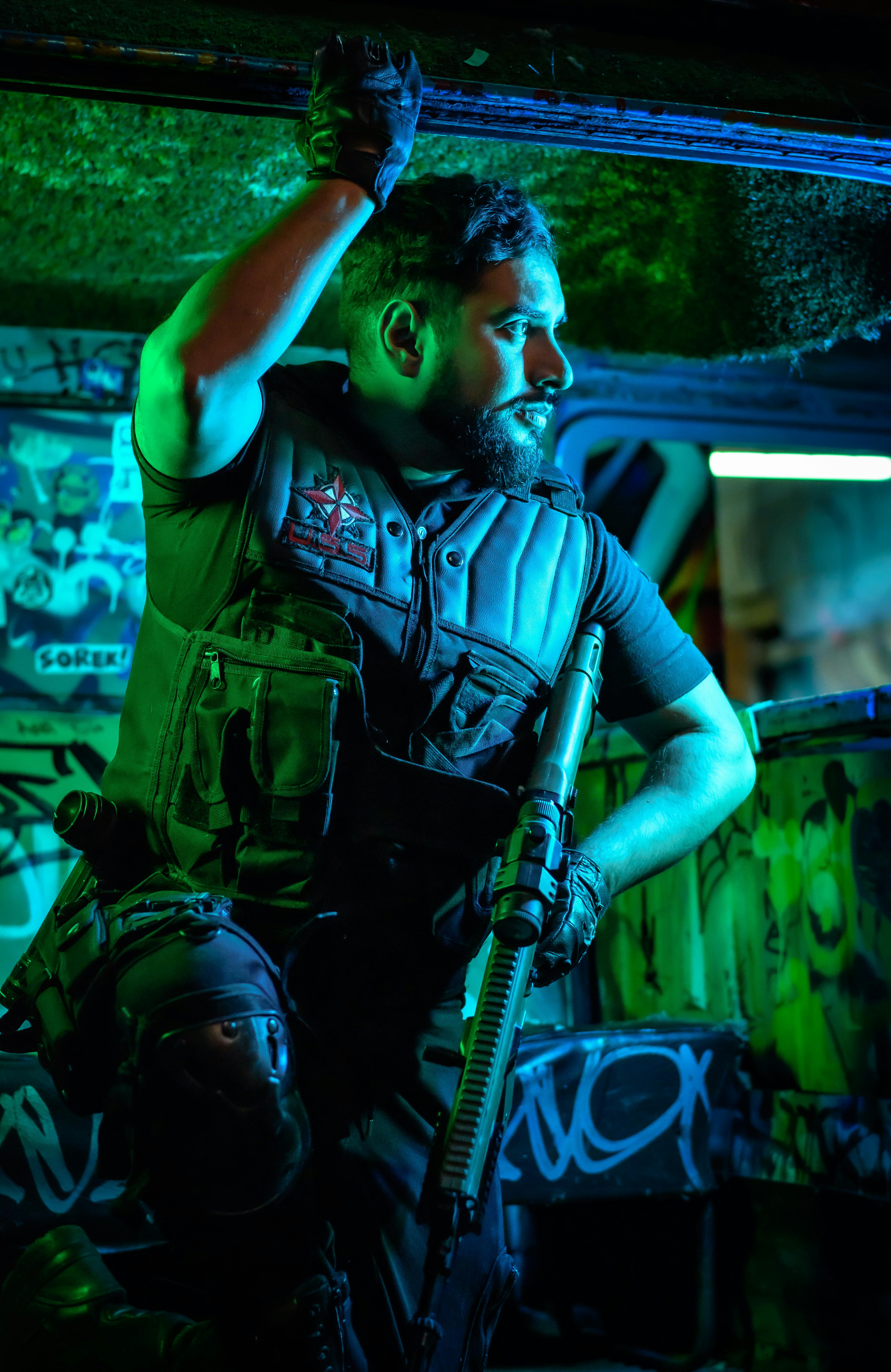 Man with Firearm at Night · Free Stock Photo