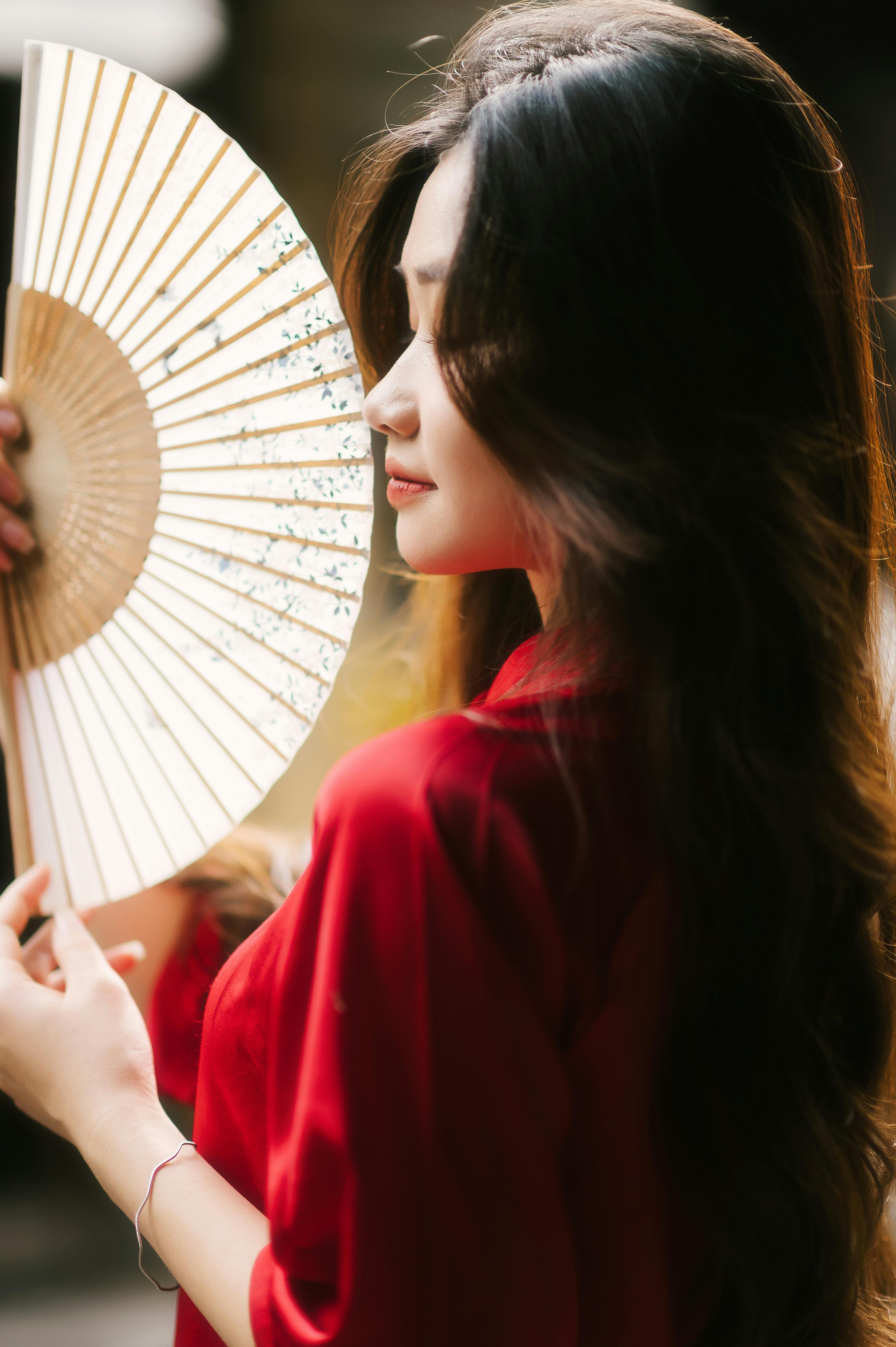 Brunette Woman with Hand Fan · Free Stock Photo