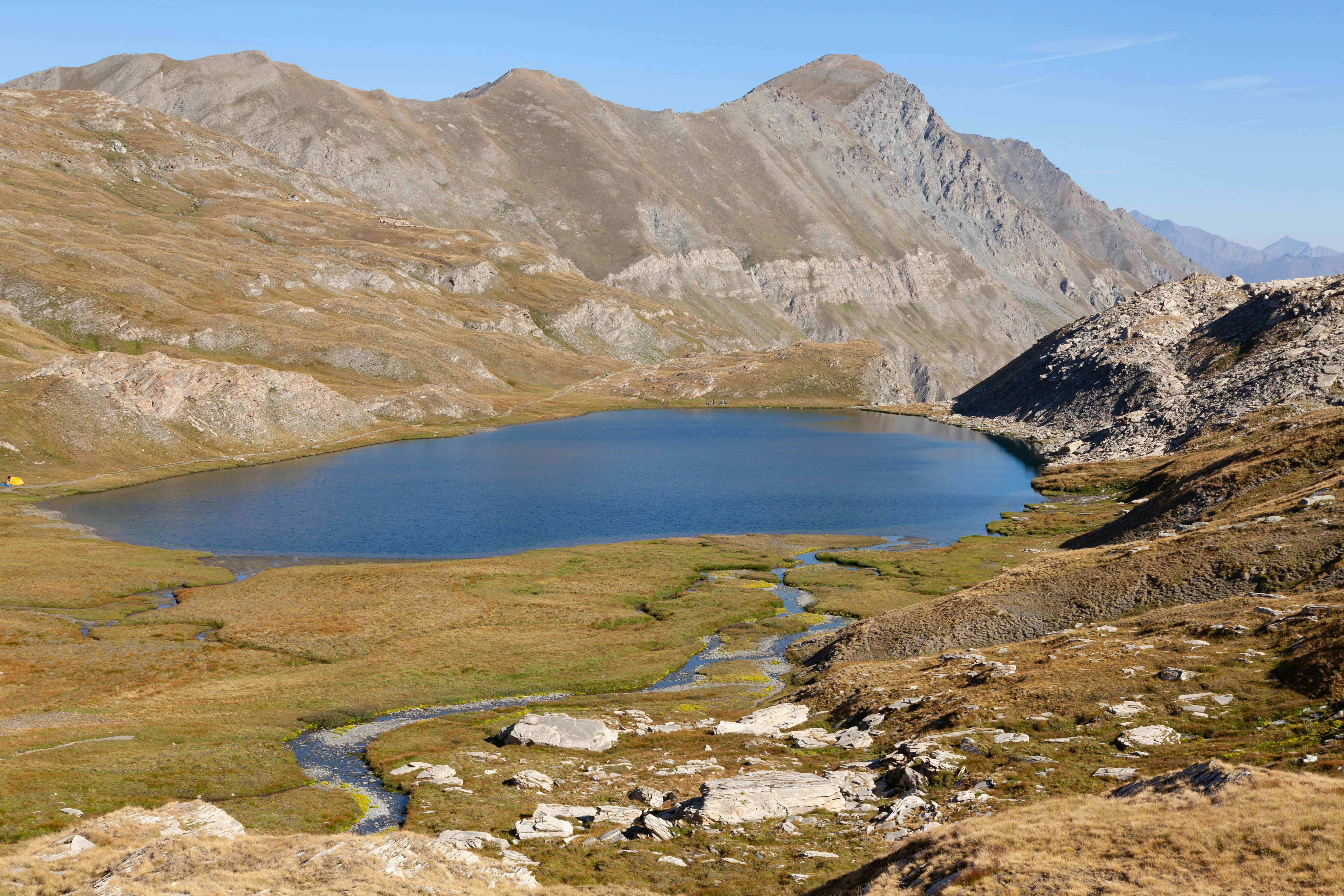 Stream Flowing into a Mountain Lake in the Alps · Free Stock Photo