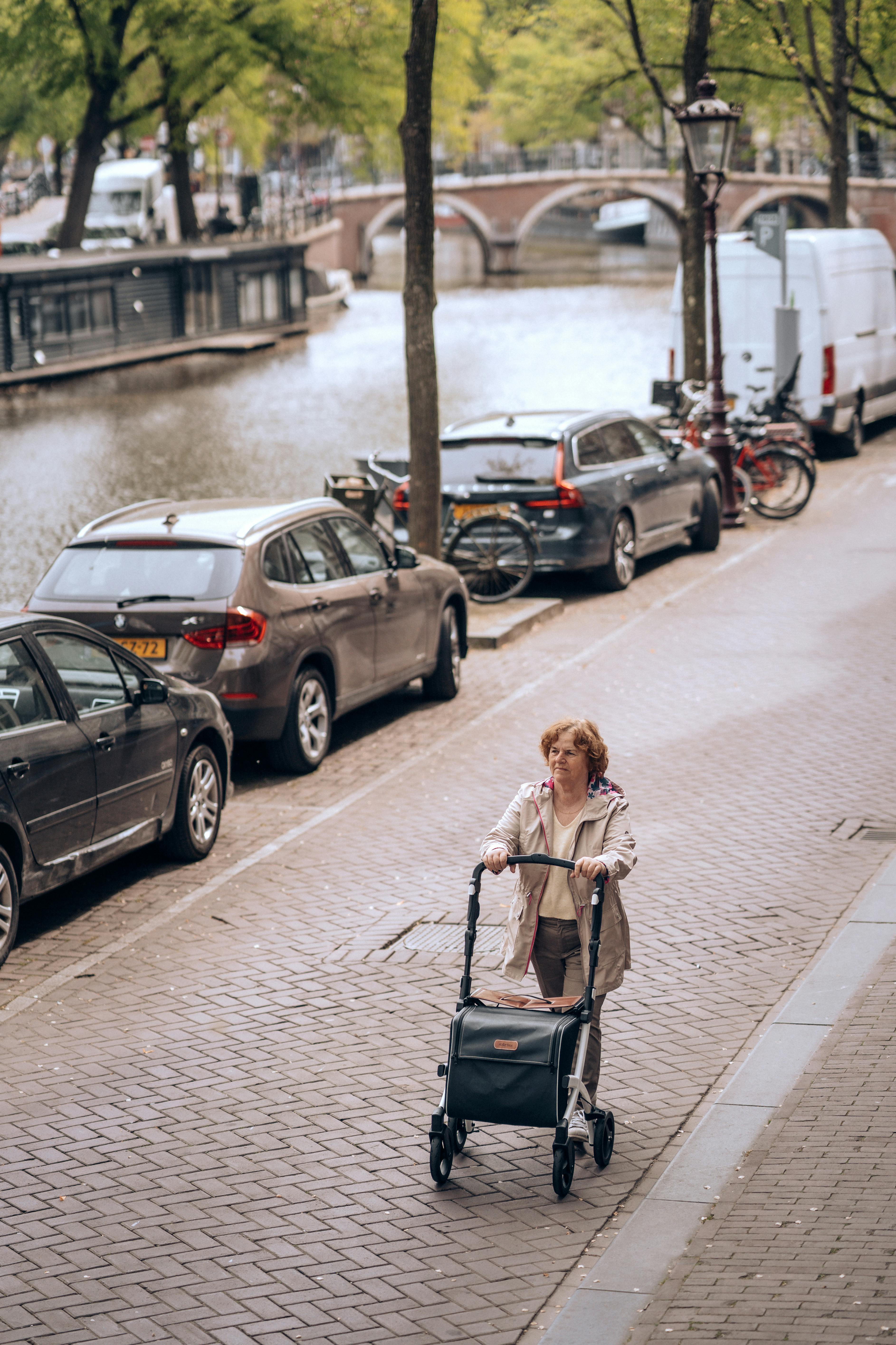 Woman with Stroller on Street in Amsterdam · Free Stock Photo