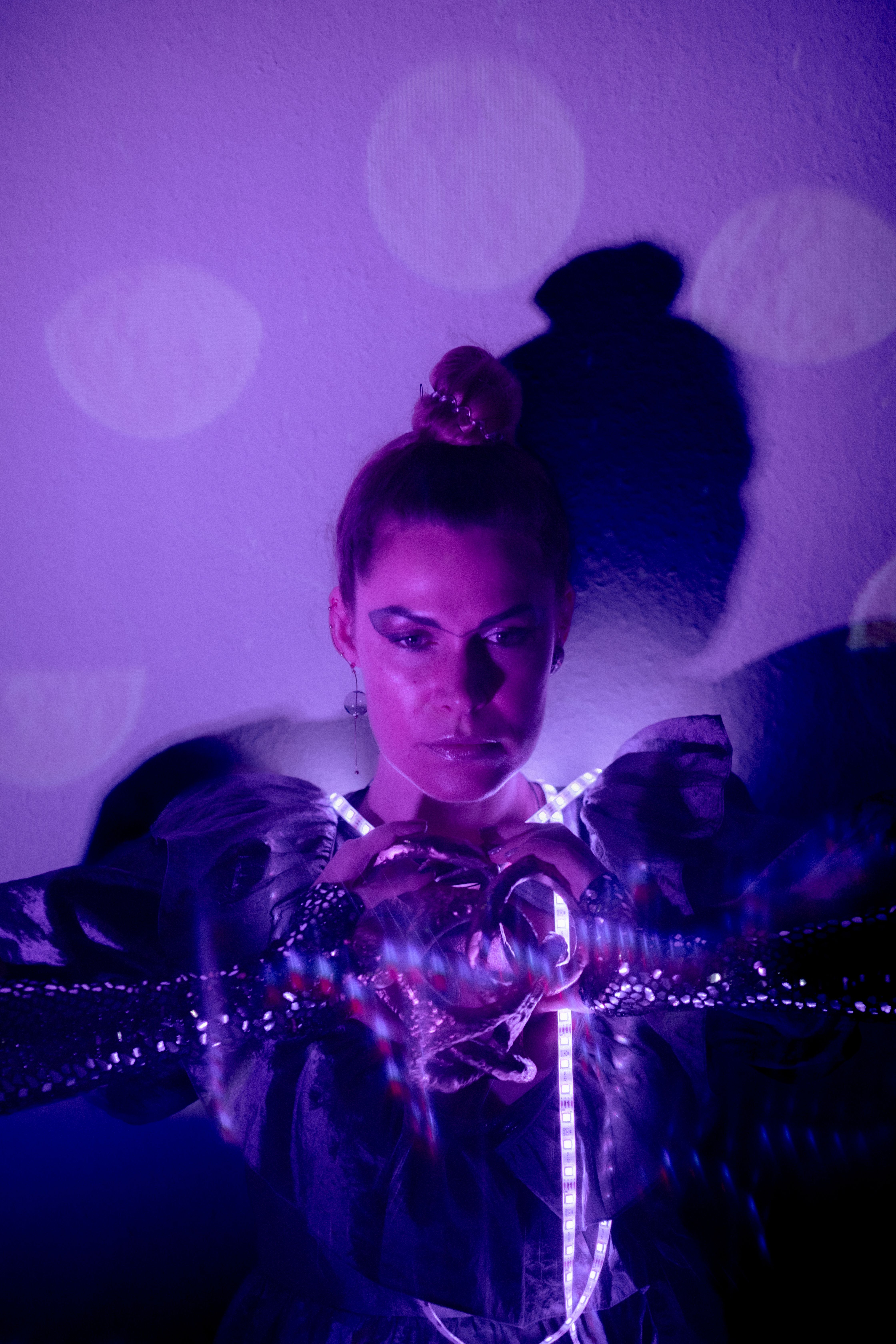 Artistic Photo of a Woman Wearing a Purple LED Light String on Her Neck ...