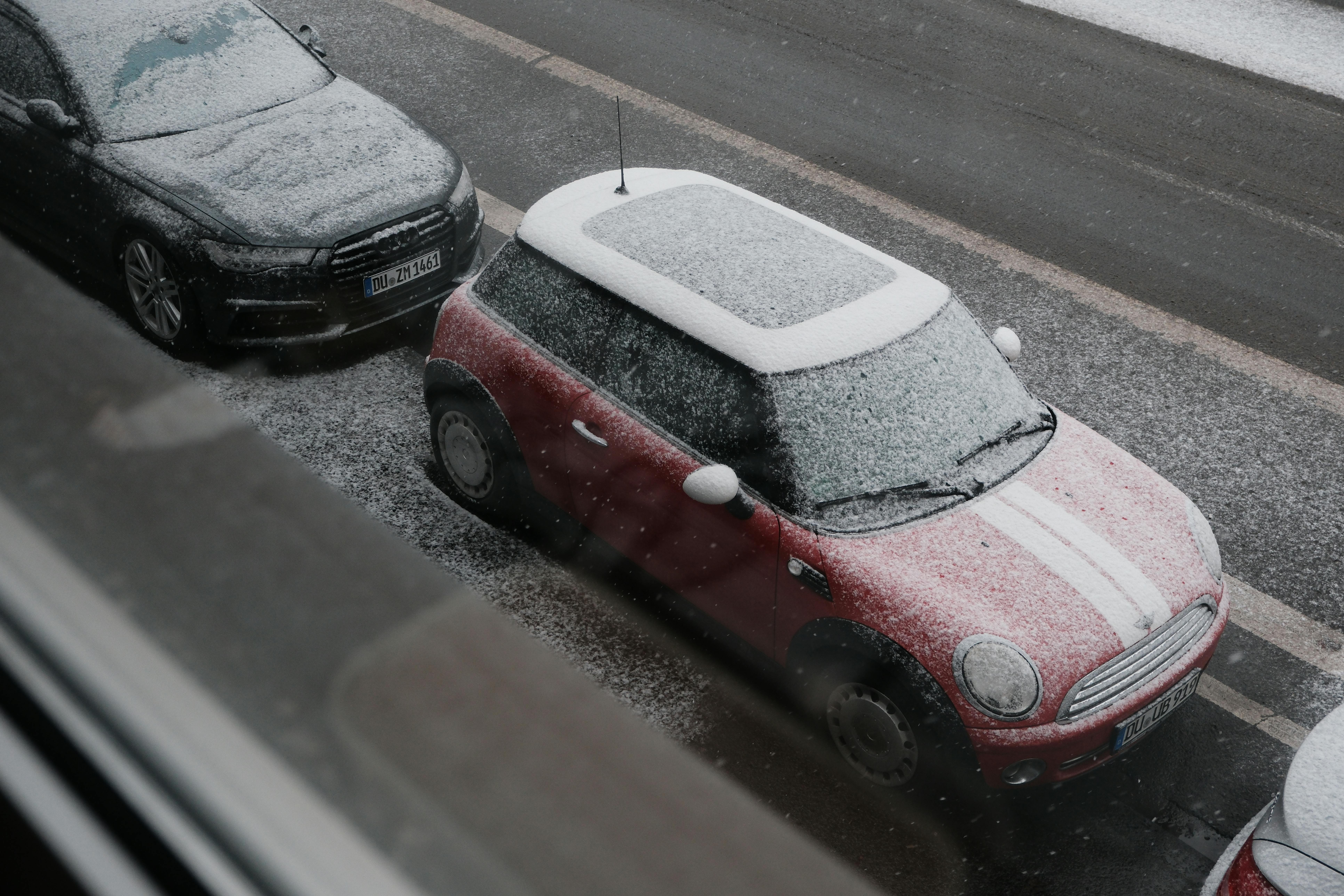Snow on Parked Mini Cooper behind Window · Free Stock Photo