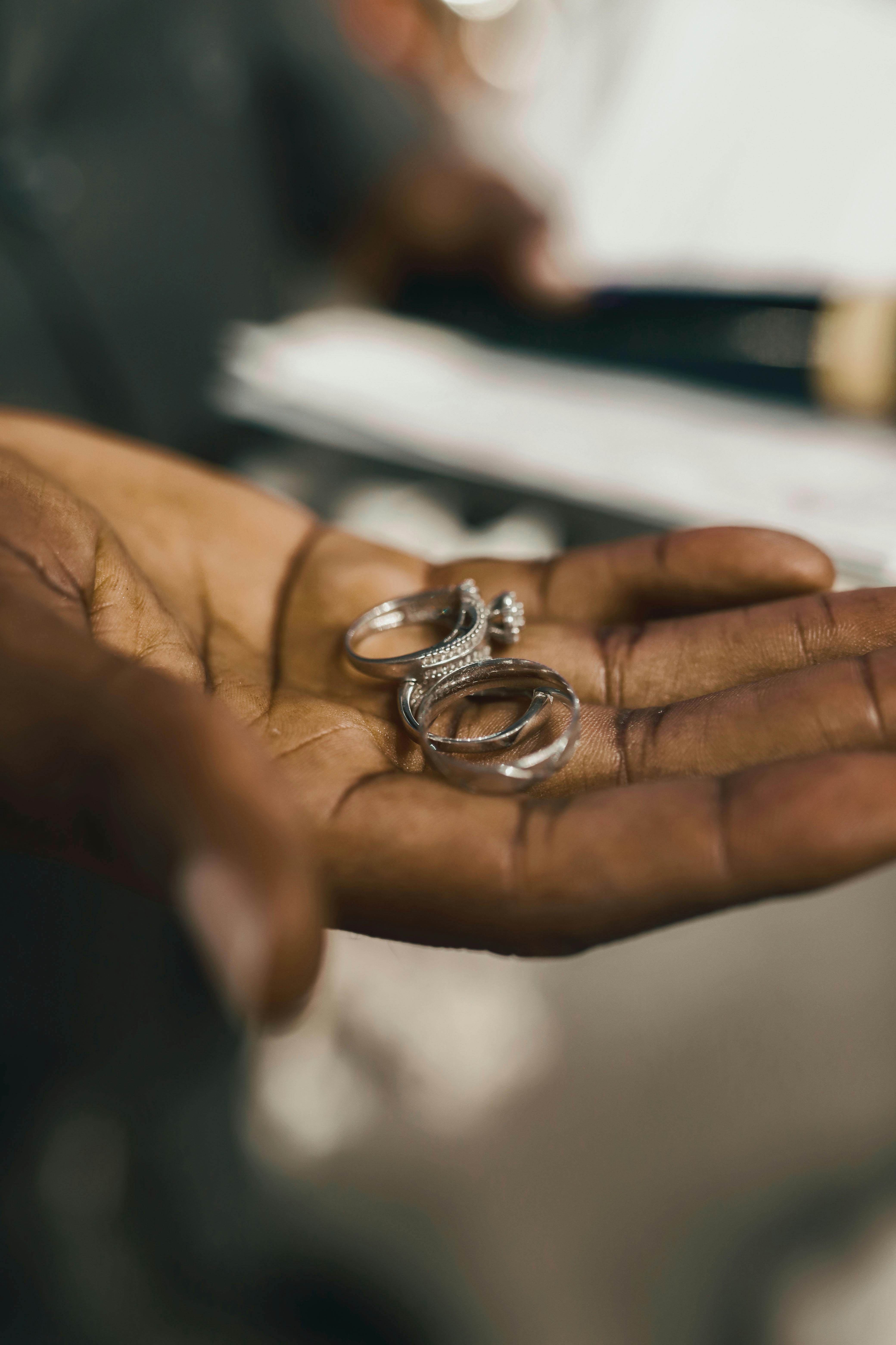 Person Wearing Silver Rings · Free Stock Photo