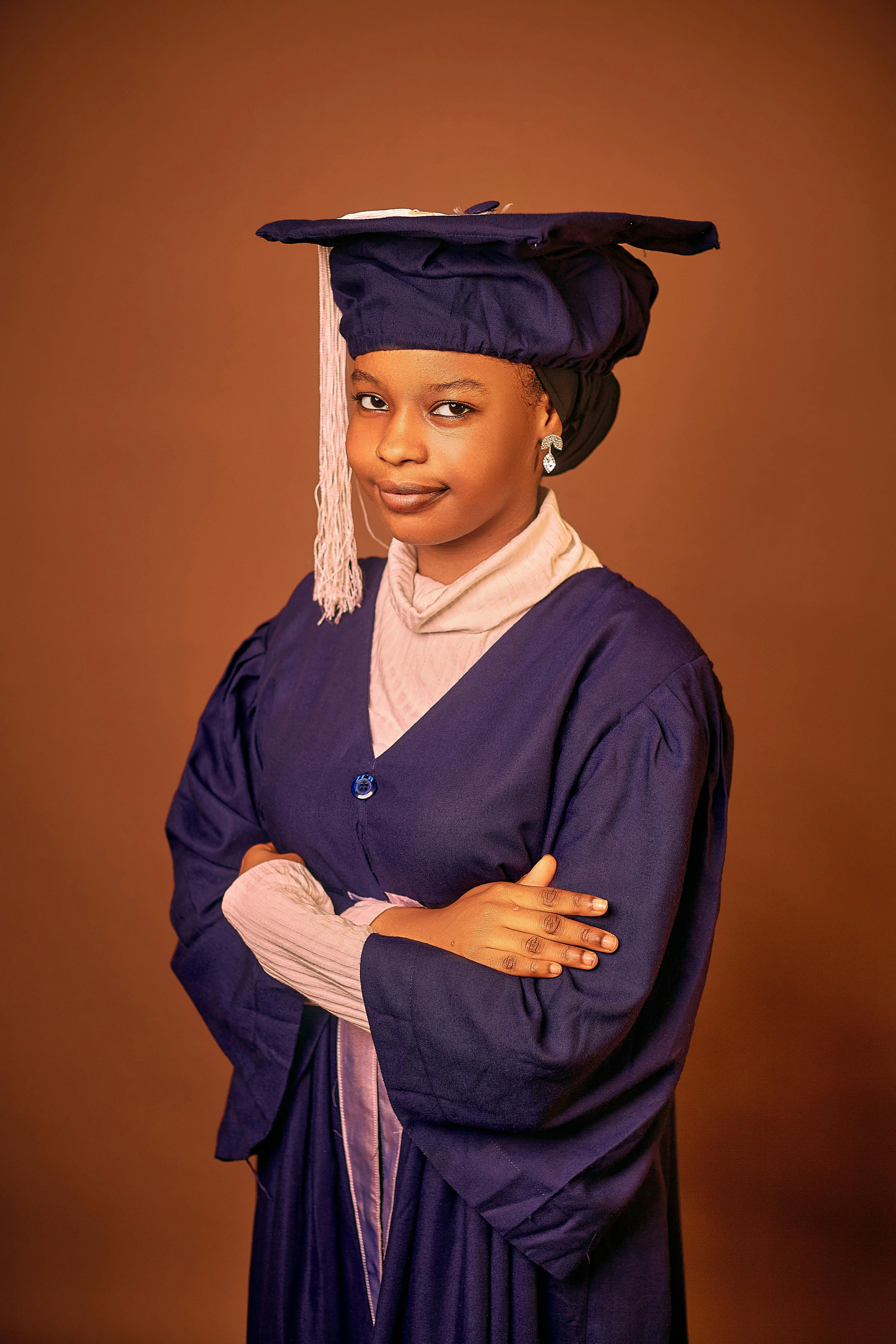 Portrait of Graduate in Purple Gown · Free Stock Photo