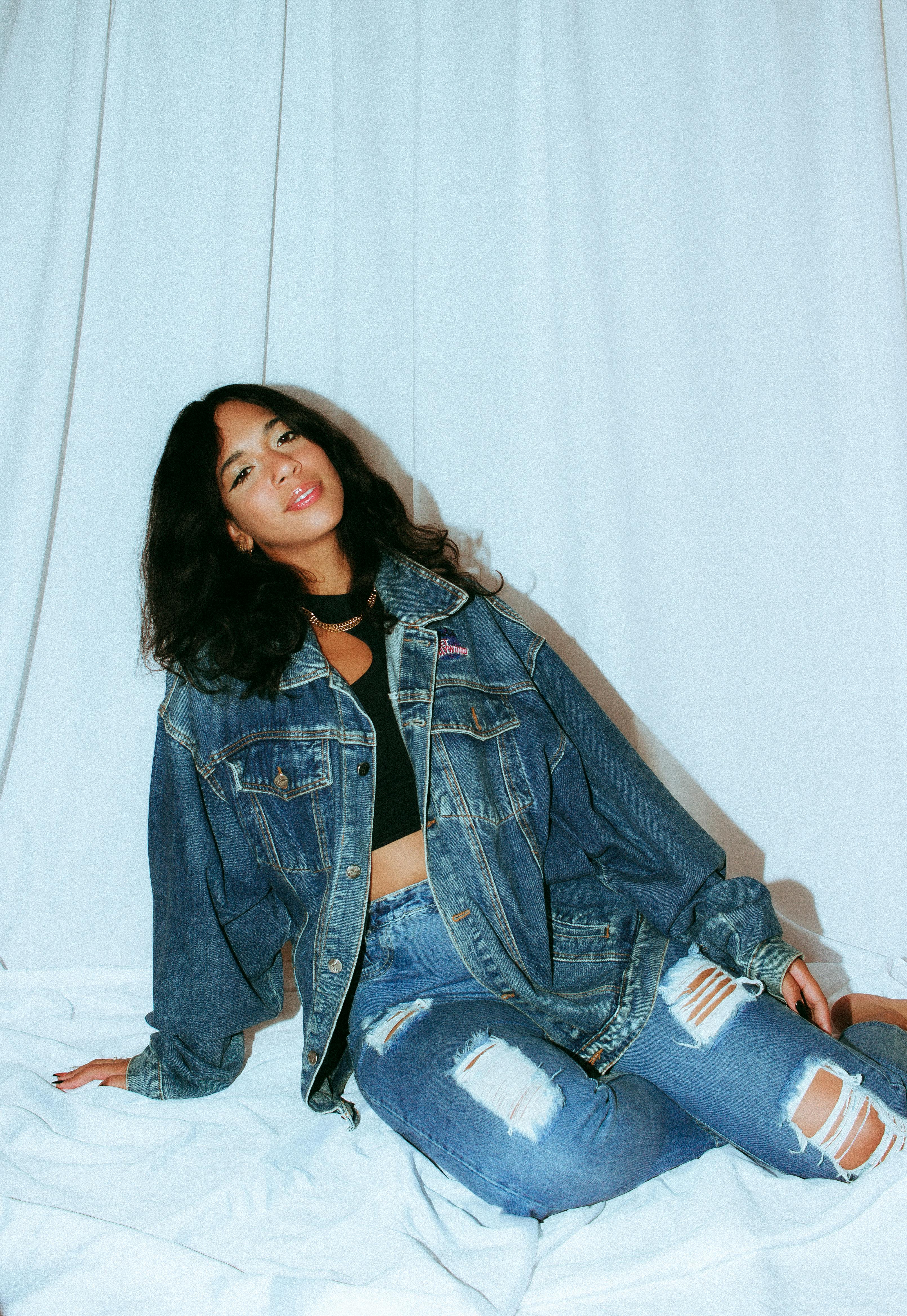 Model Wearing Denim Jacket on Black Top · Free Stock Photo