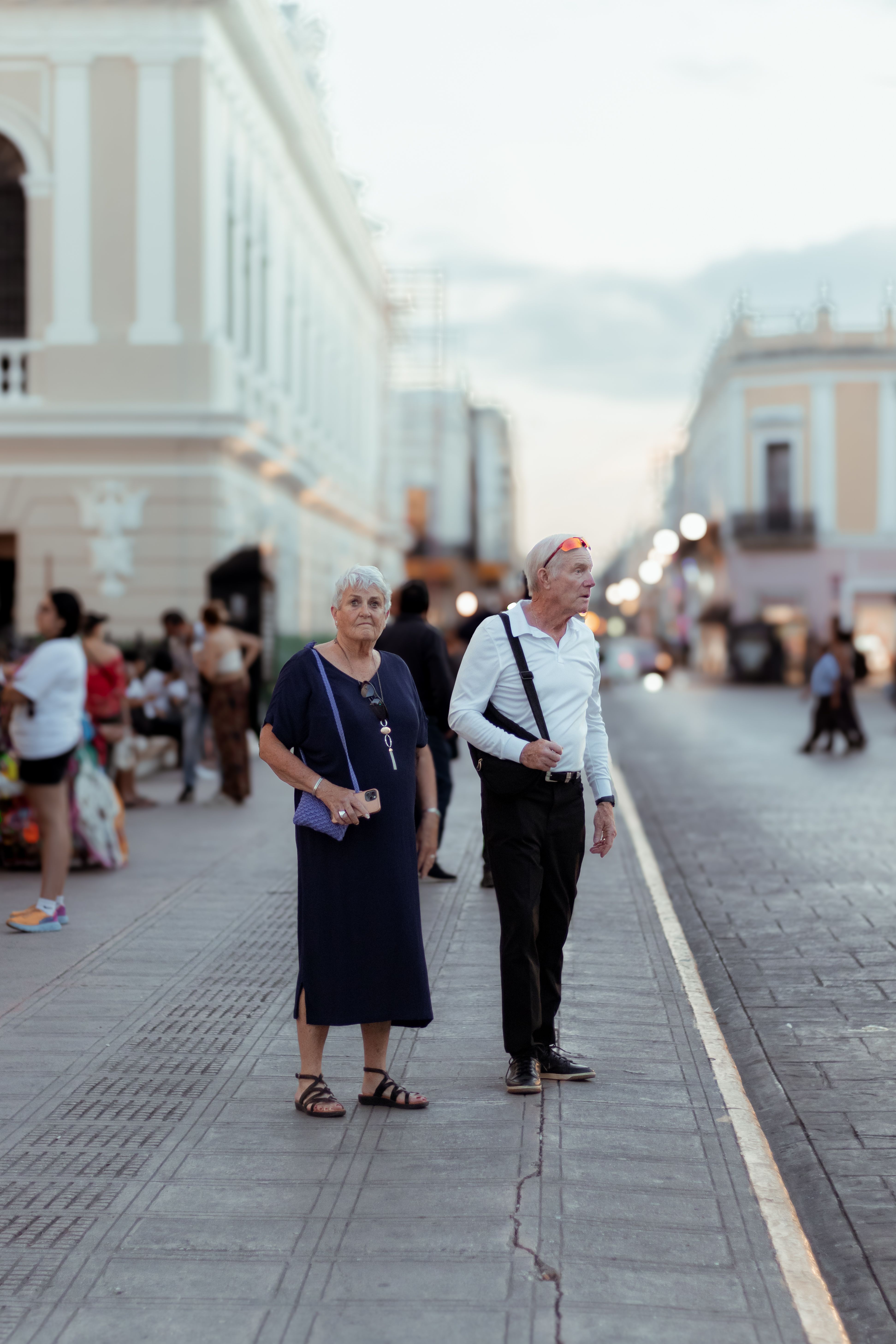 Two People Standing on a Sidewalk · Free Stock Photo