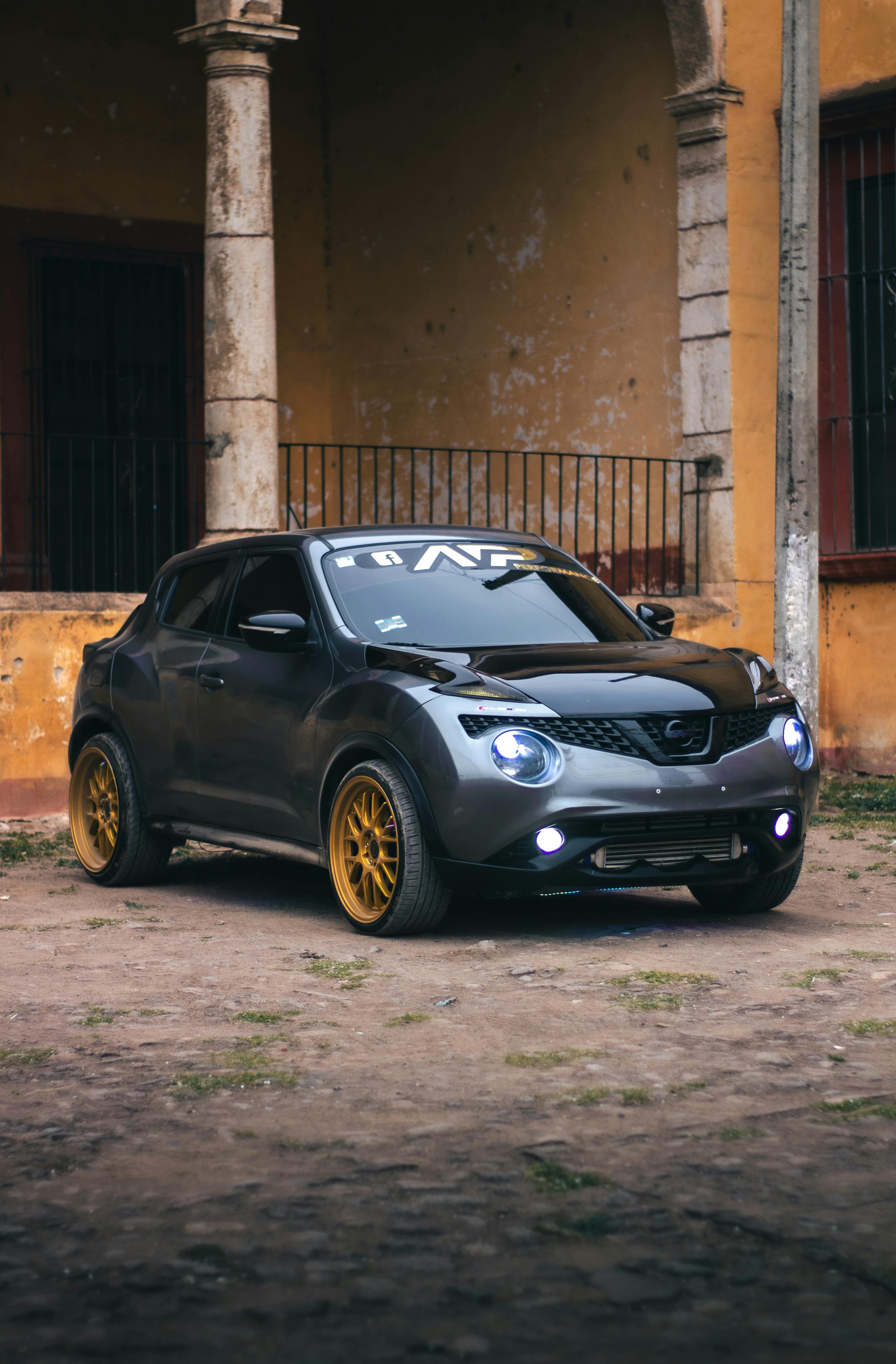 Gray Nissan Juke Parked in Front of the Building · Free Stock Photo