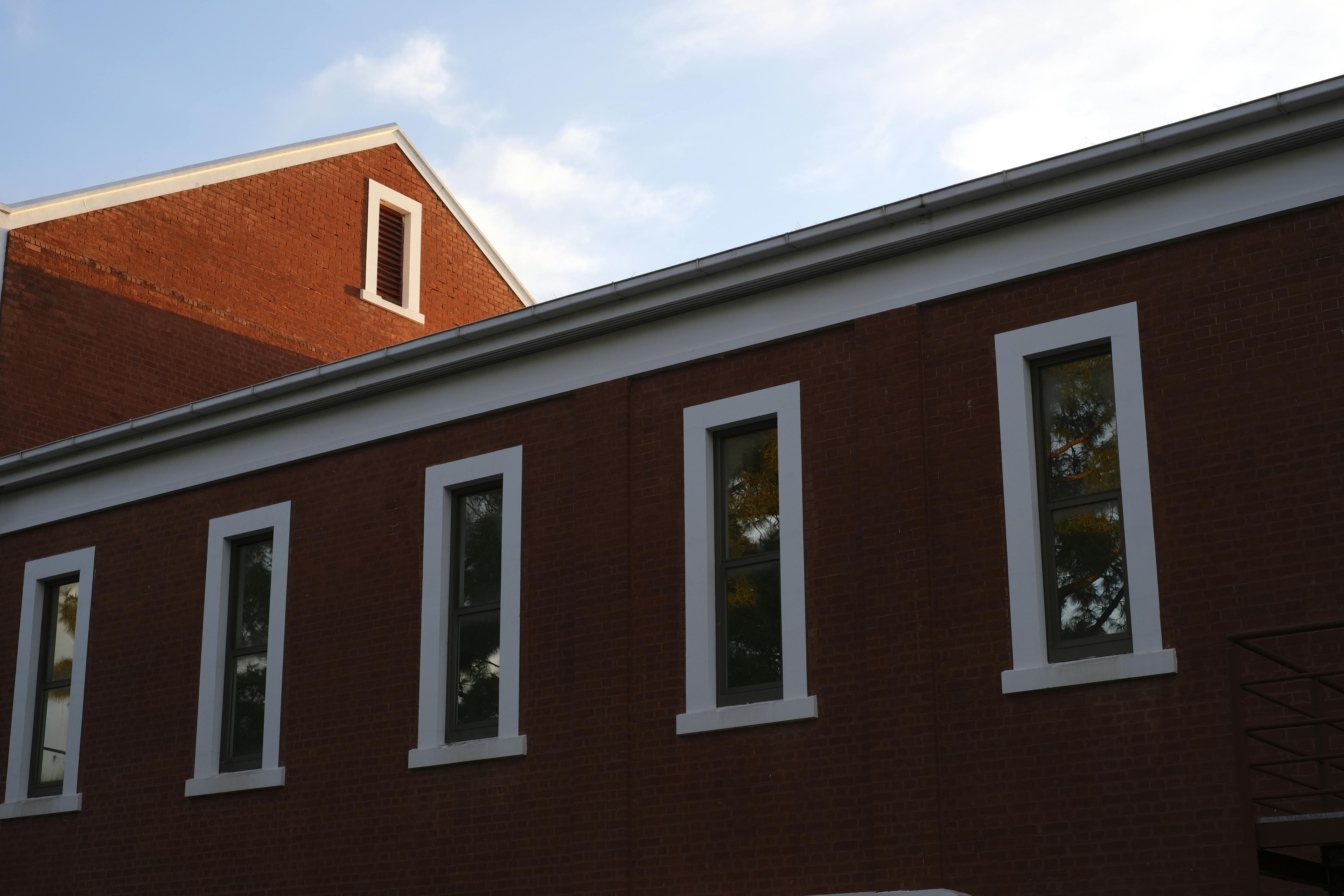 Red Brick Building in Shadow · Free Stock Photo
