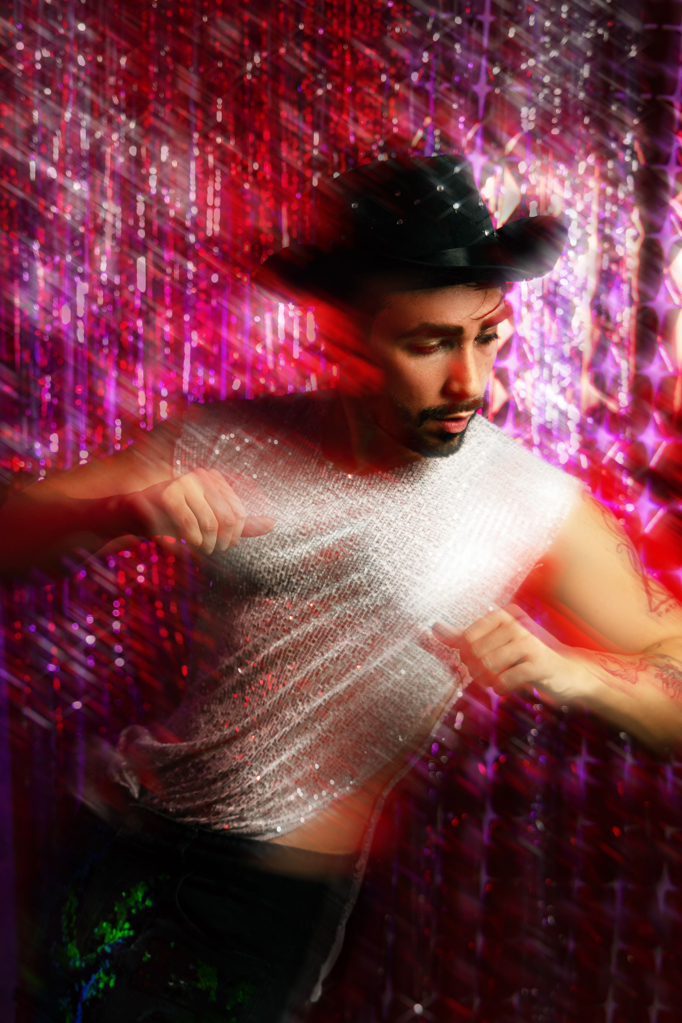 Blurred Man in Hat and Tank Top · Free Stock Photo