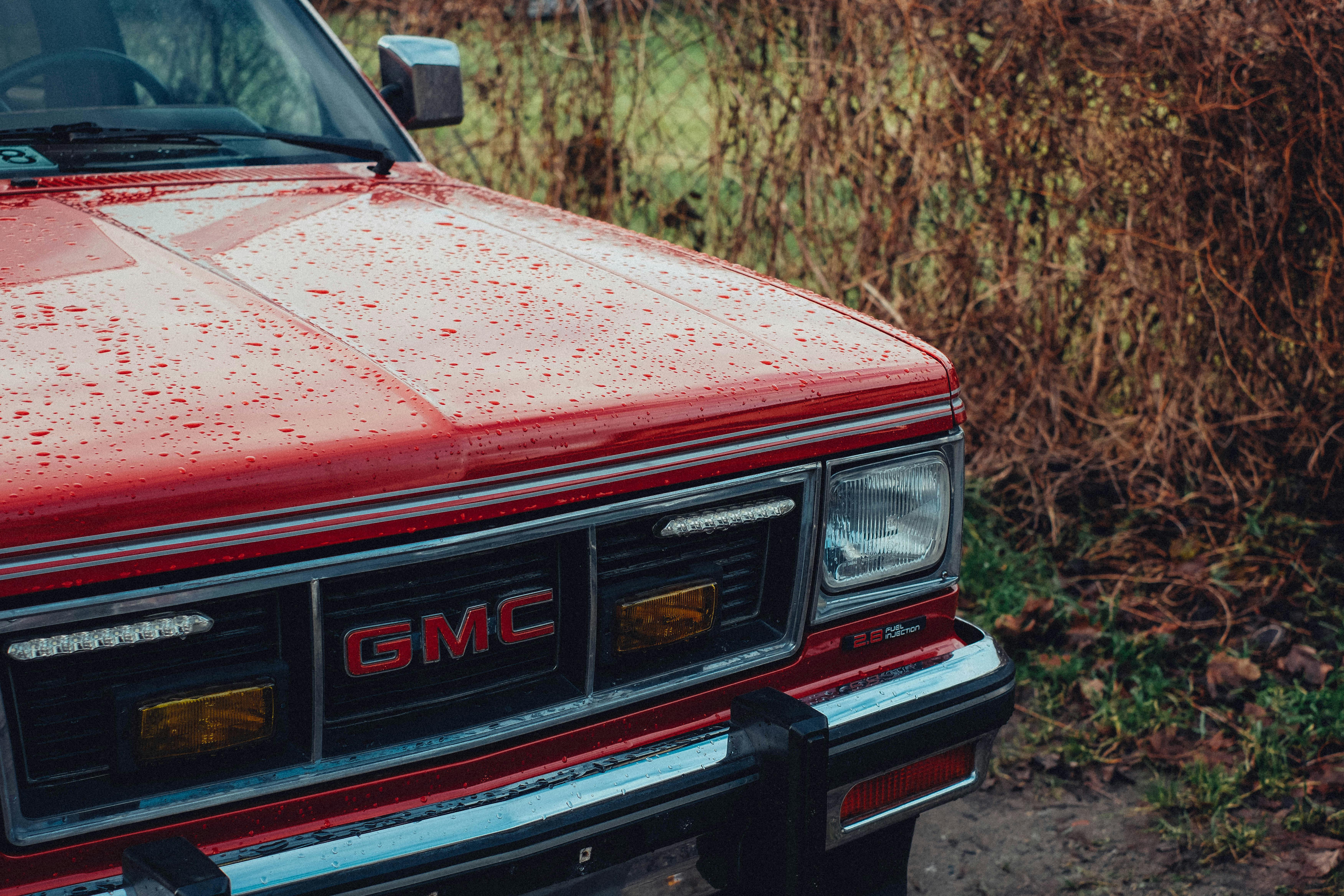 Red Classic GMC Jimmy Car Covered with Rain Drops · Free Stock Photo