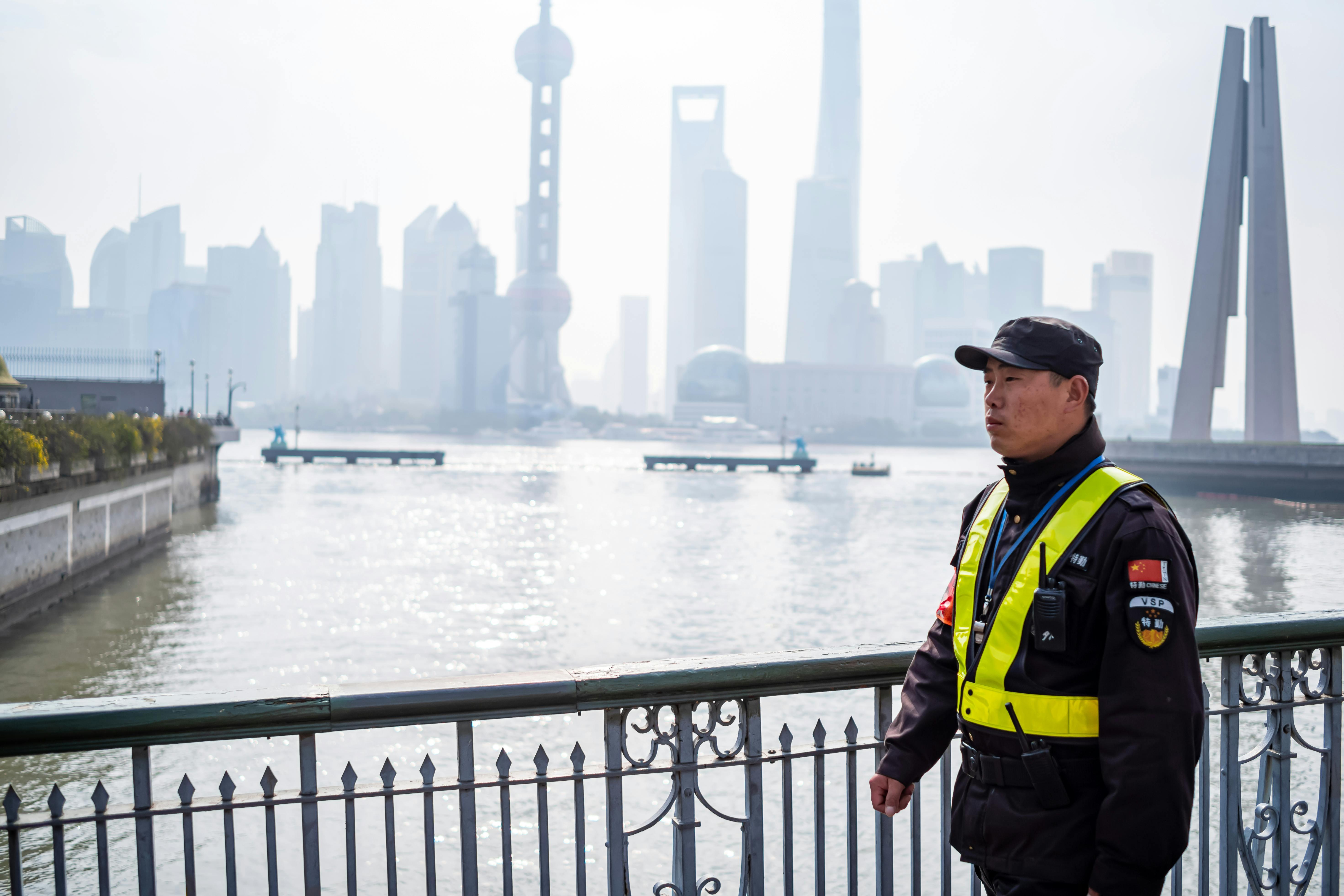 Police Officer on Bridge in Shanghai · Free Stock Photo