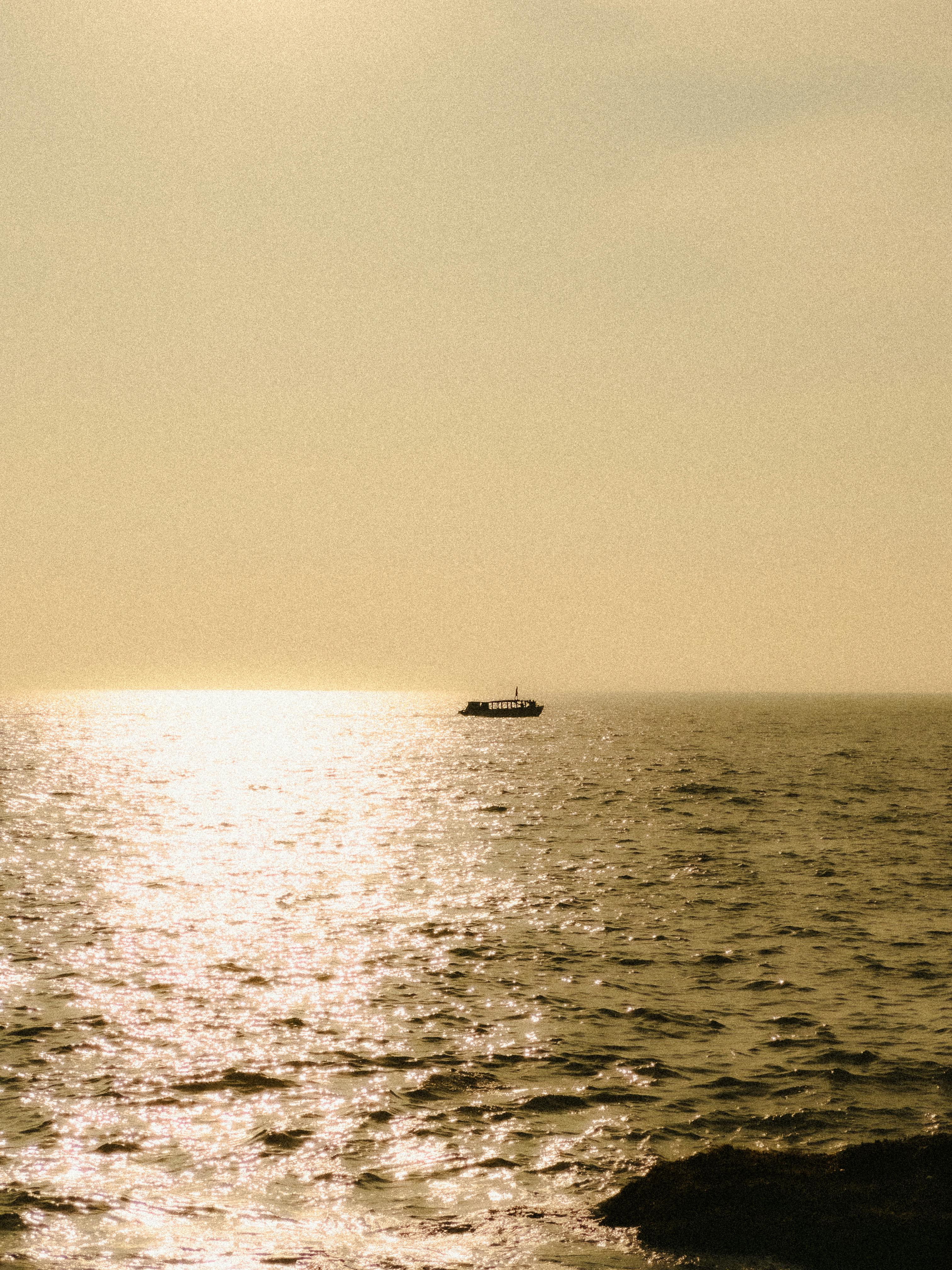 Boat on Shiny Sea at Sunset · Free Stock Photo