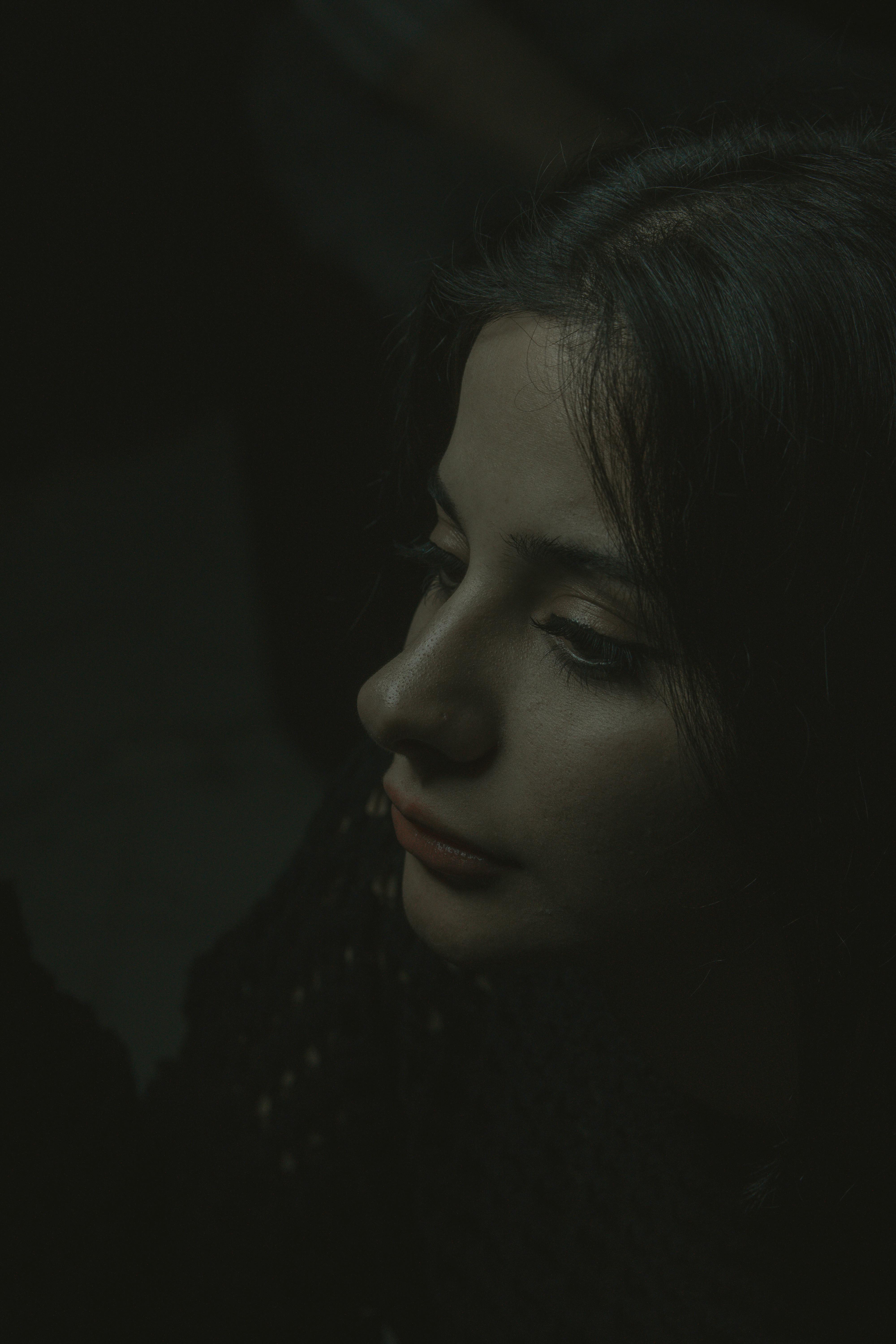 Young woman laying down on floor · Free Stock Photo