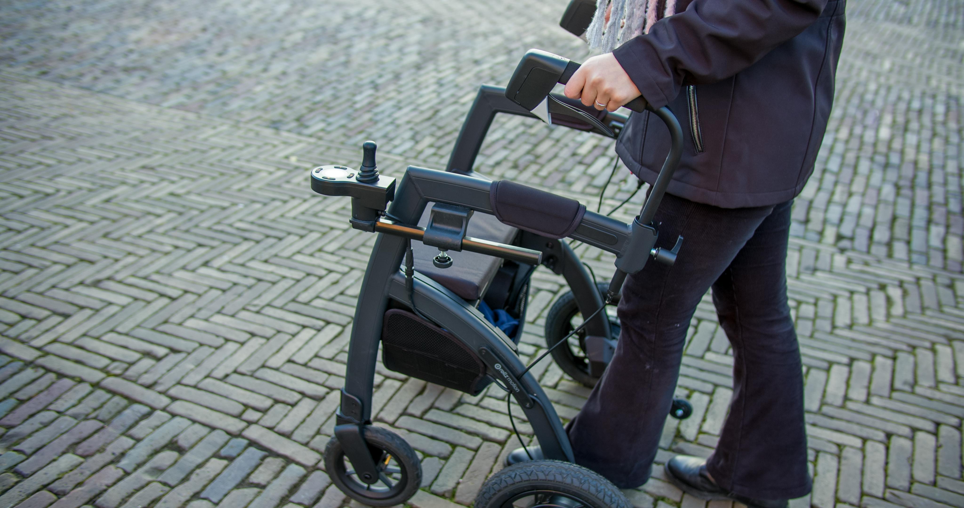 Woman walking in a rollator walker · Free Stock Photo