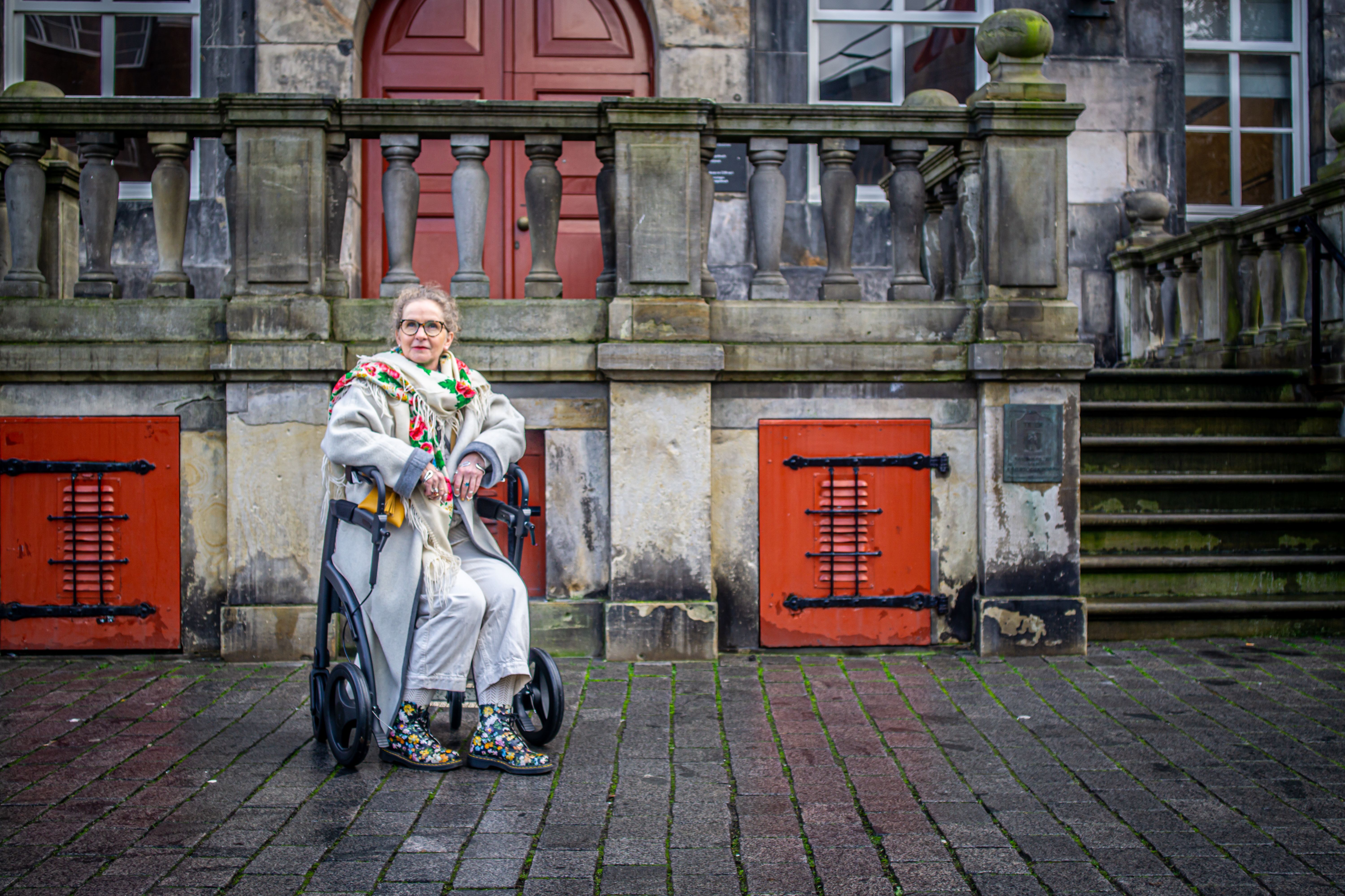 Woman Sits in Wheelchair, on Paving Street · Free Stock Photo