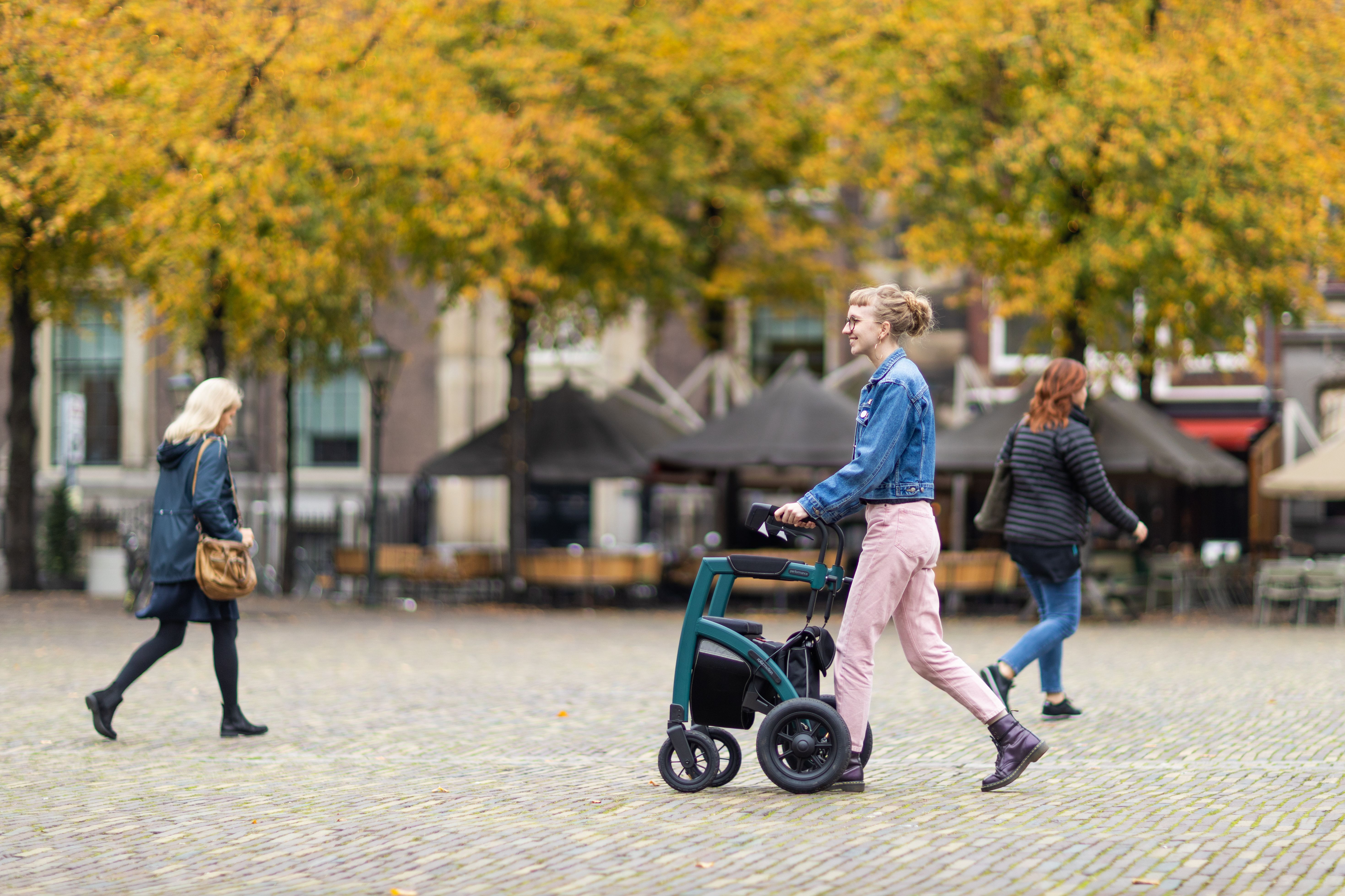 Smiling Woman Walking with Walker · Free Stock Photo