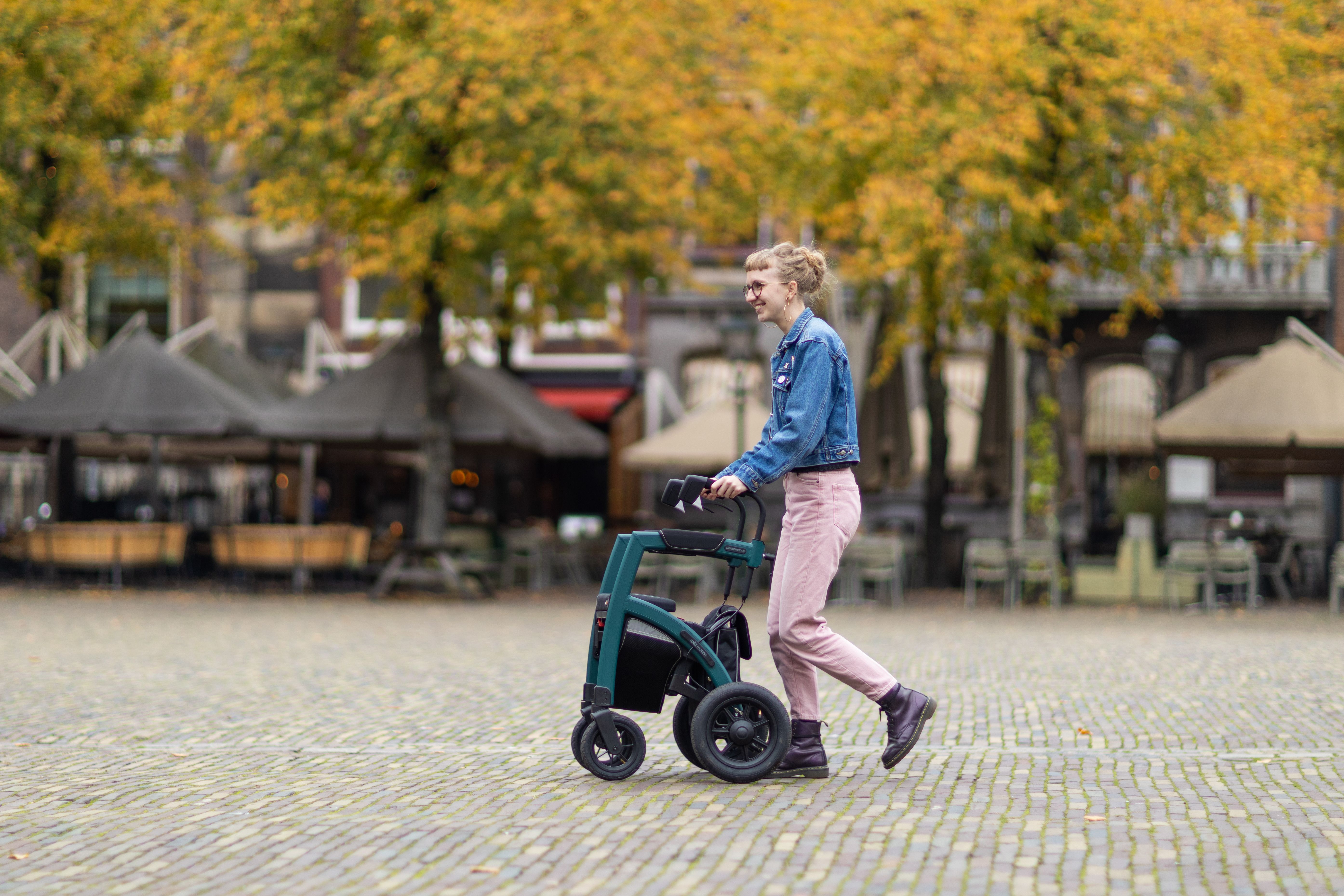 Young girl walking with a rollator walker · Free Stock Photo
